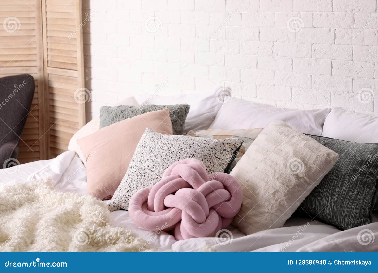 Different Pillows on Bed in Room. Stock Photo - Image of cushions ...