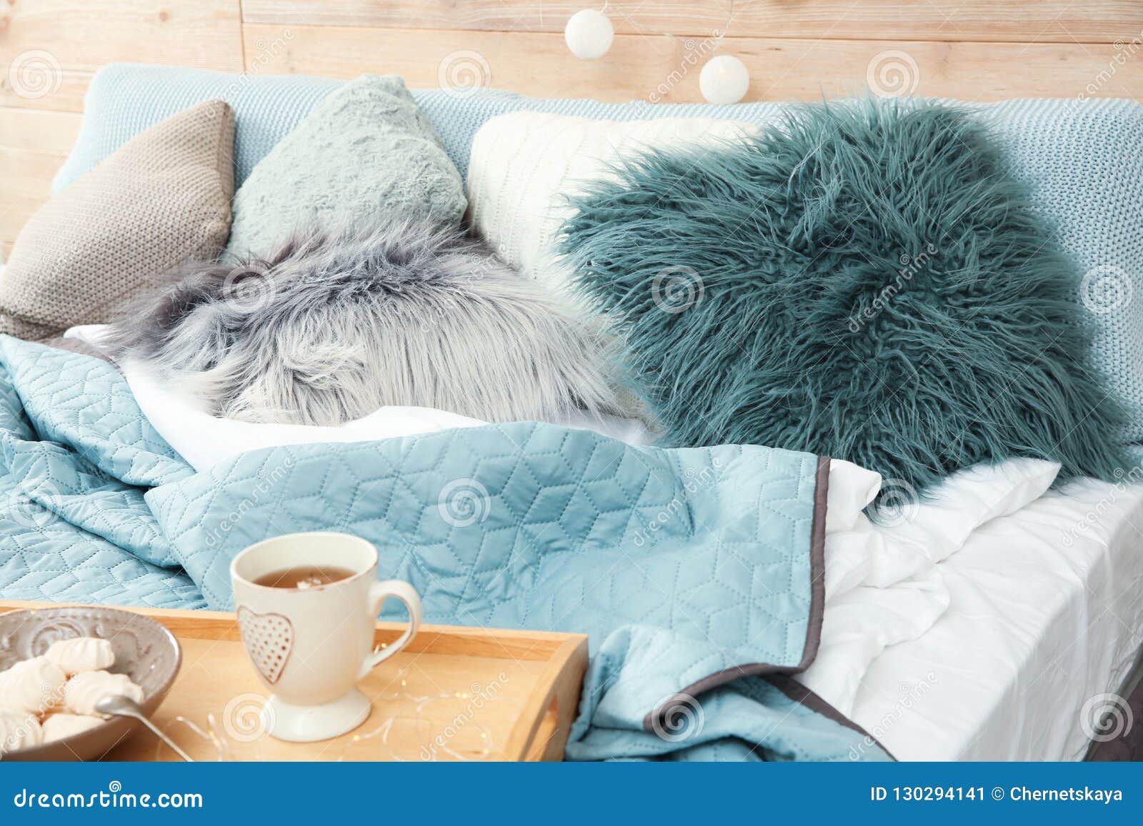Different Pillows and Tray with Breakfast on Bed in Room. Stock Image ...