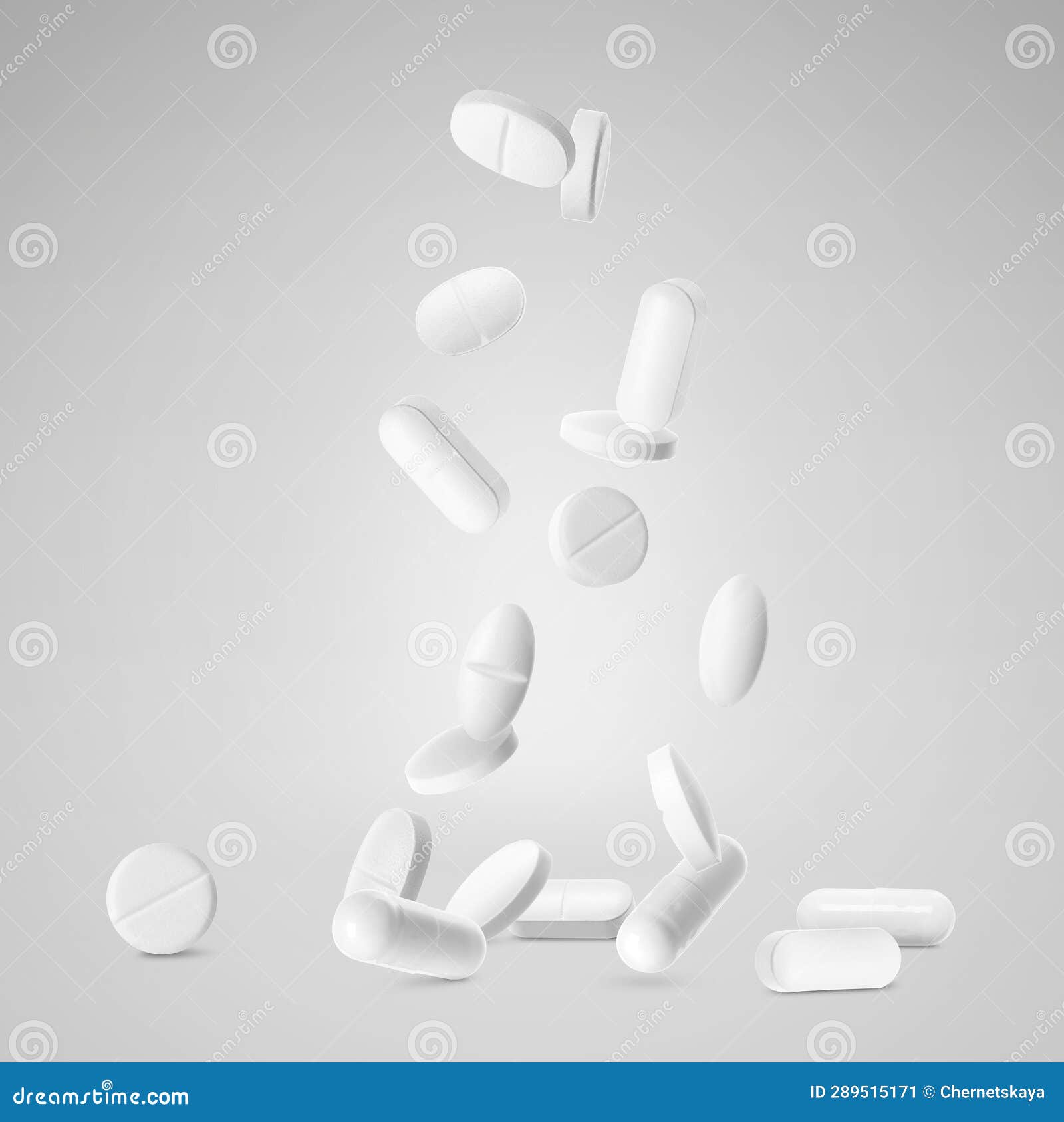 Many Different Pills Falling on Light Grey Background Stock ...