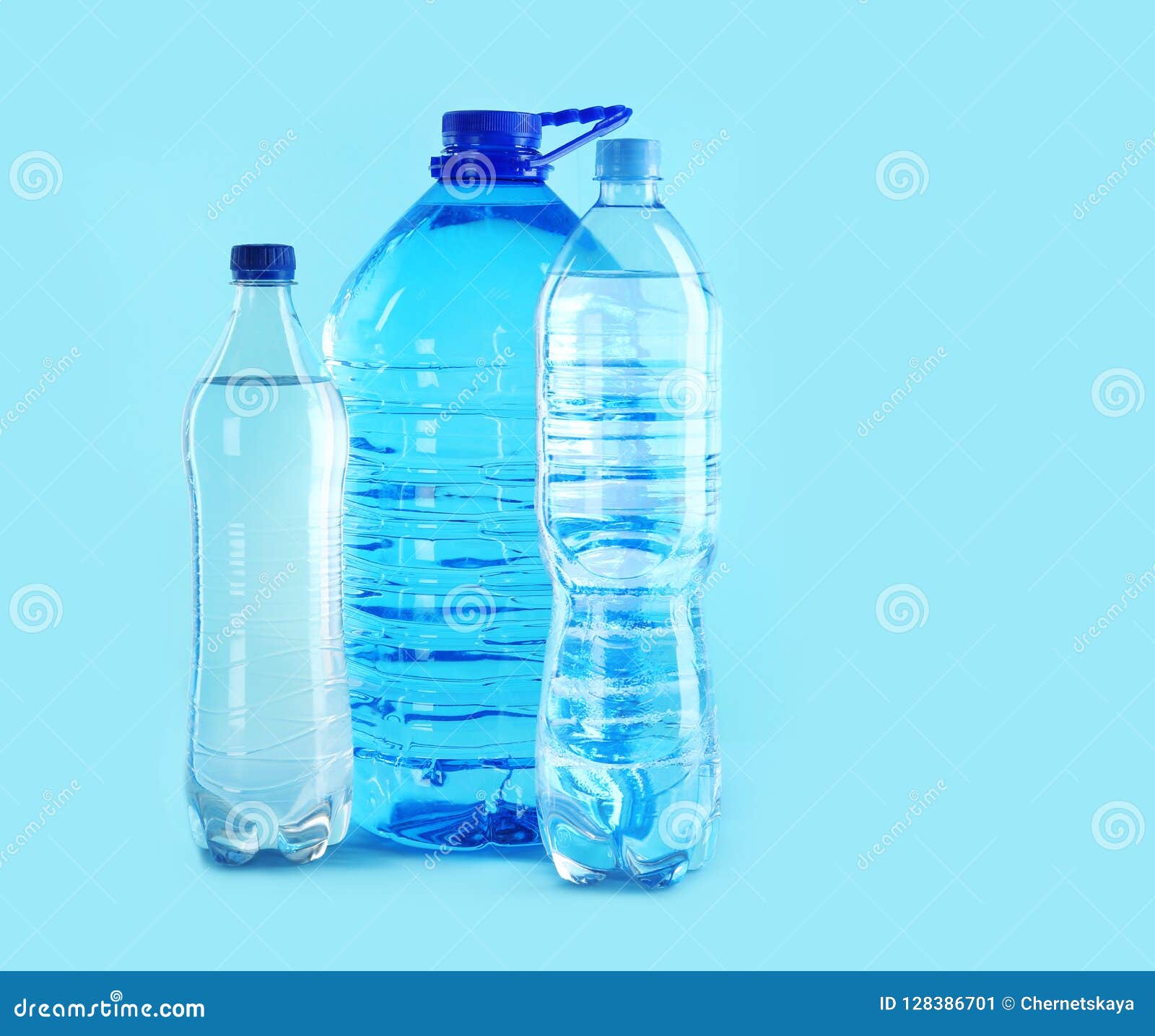 Different Plastic Bottles with Pure Water on Color Background Stock ...
