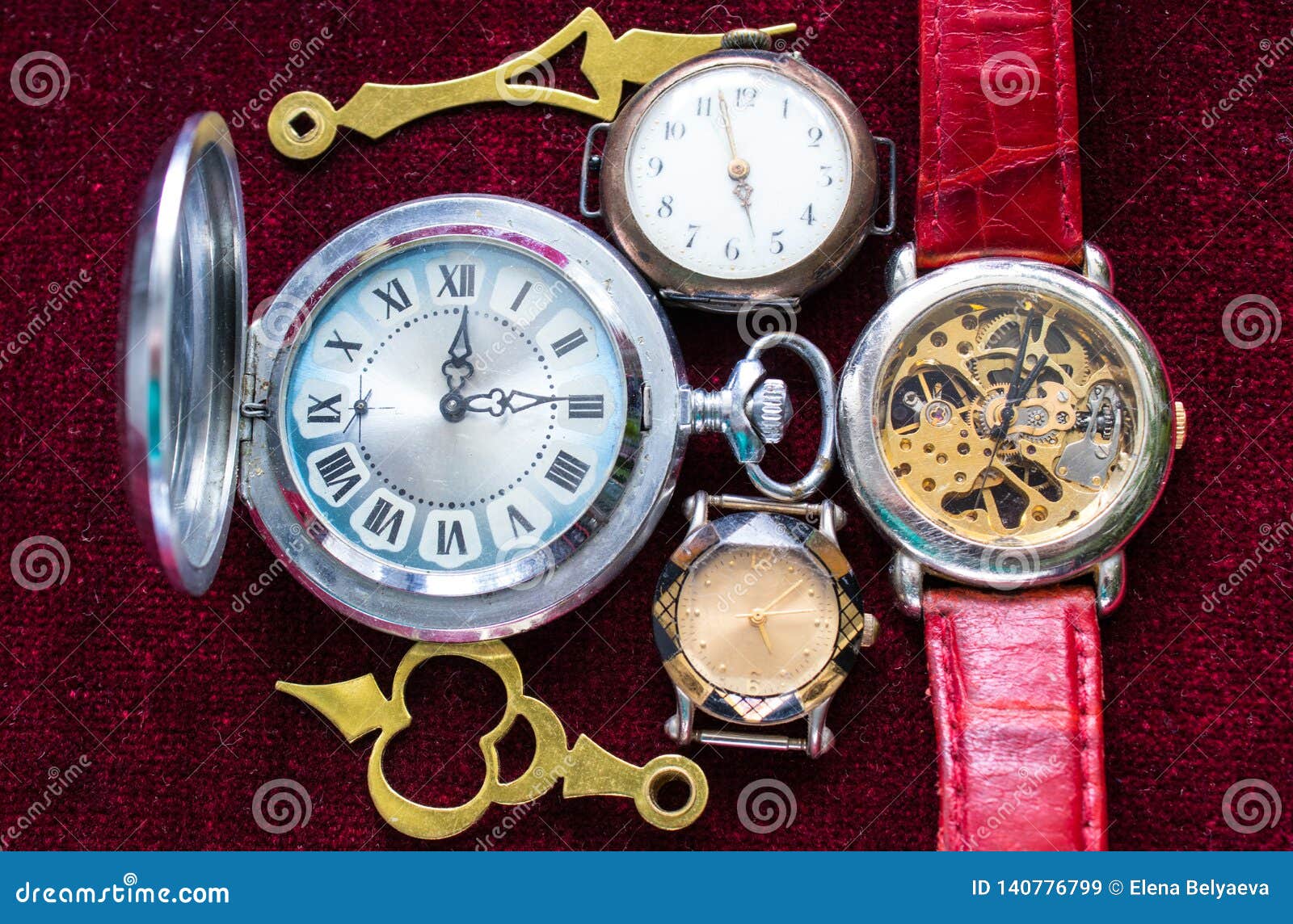 Different Watches and Hands are on the Red Velvet Stock Image - Image ...