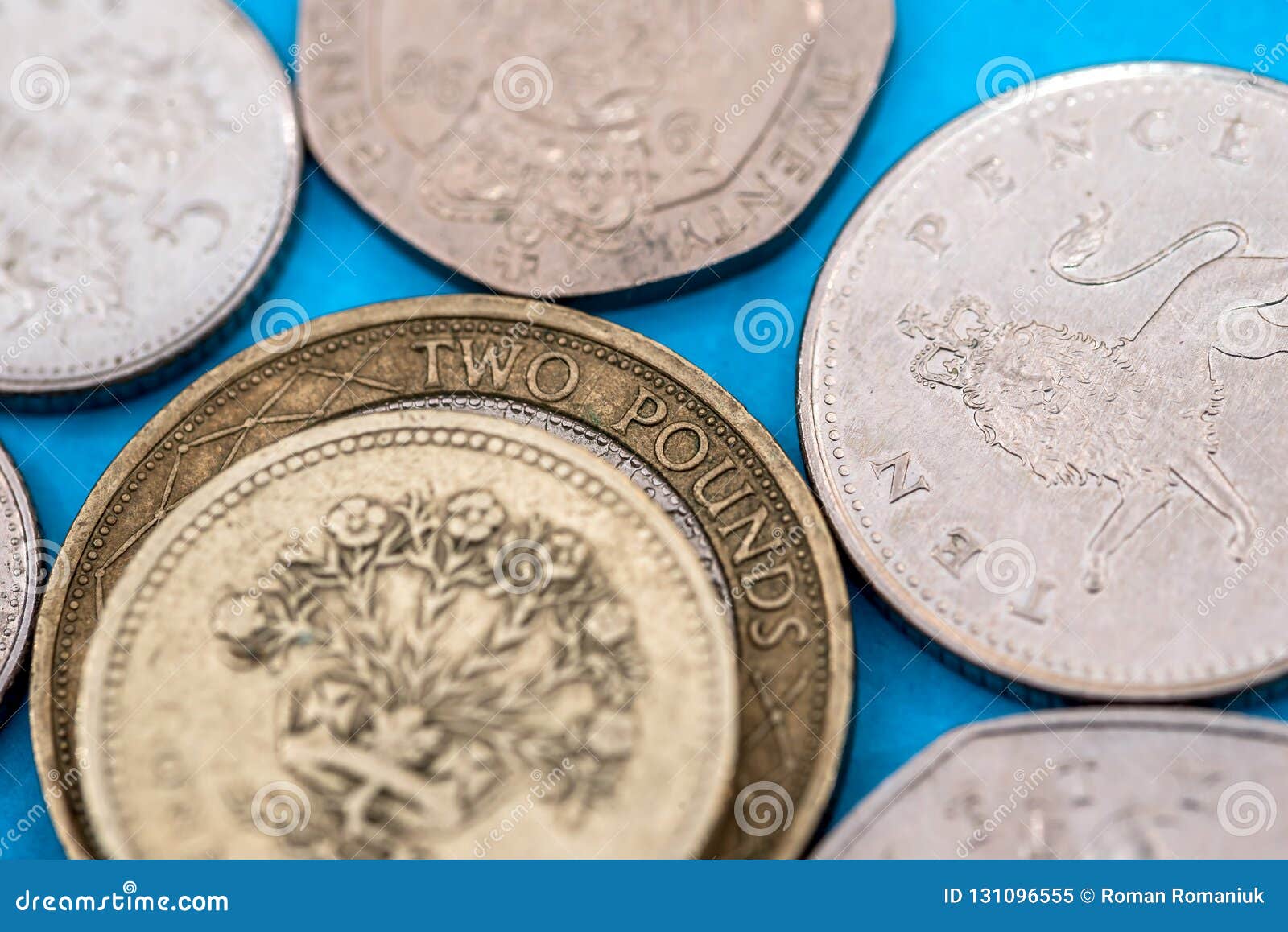 Different Pound Coins on a Blue Background Stock Image - Image of ...