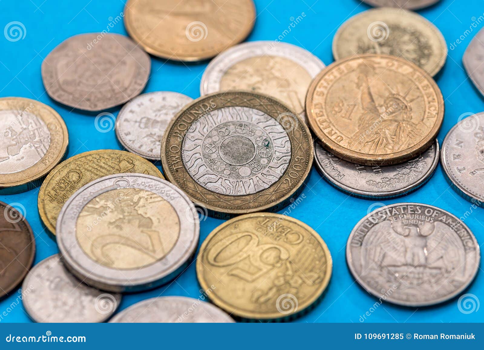 Pound Coins on a Blue Background. Stock Image - Image of background ...