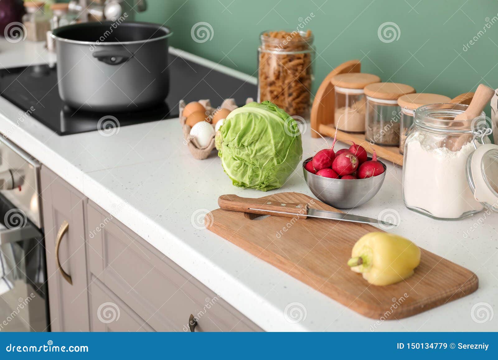 Different Products on Table in Modern Kitchen Stock Image - Image of ...