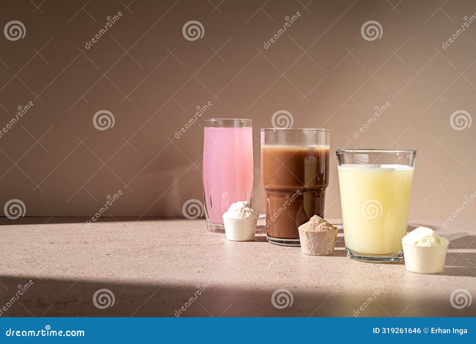 Different Protein Shake Drinks in Glasses and Protein Powder in Scoops ...