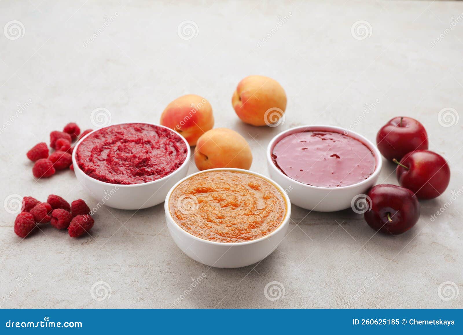 Different Puree in Bowls and Fresh Fruits on Light Grey Table Stock ...