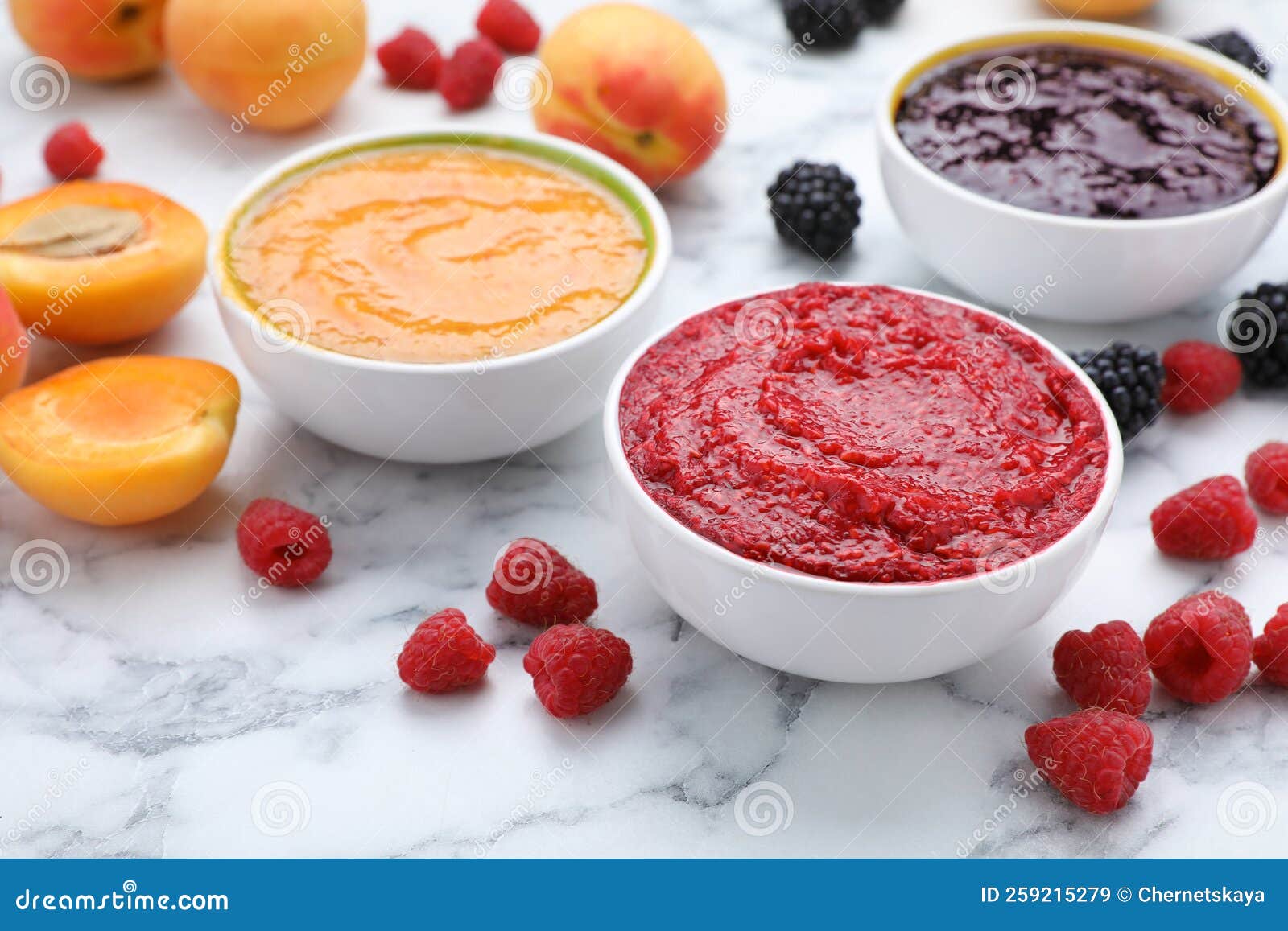 Different Puree in Bowls and Fresh Ingredients on White Marble Table ...