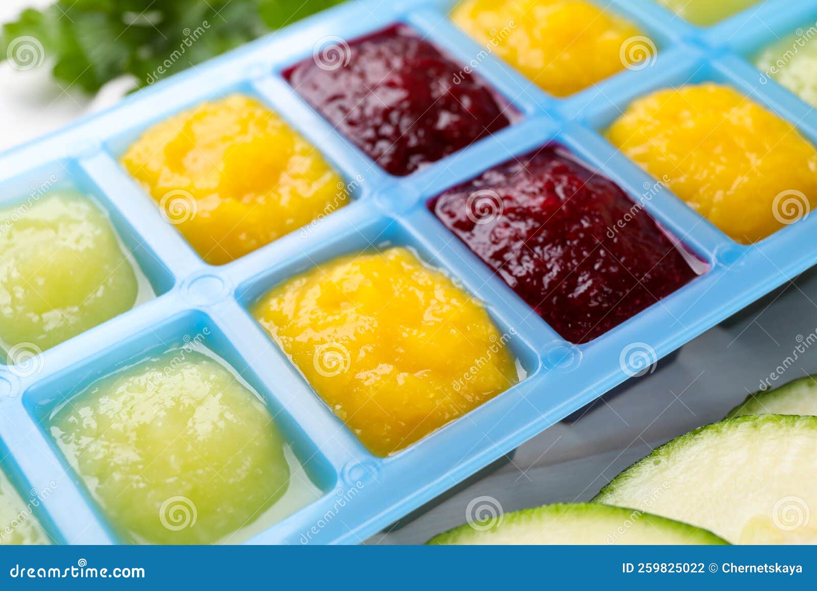 Different Purees in Ice Cube Tray and Ingredients on Table, Closeup ...