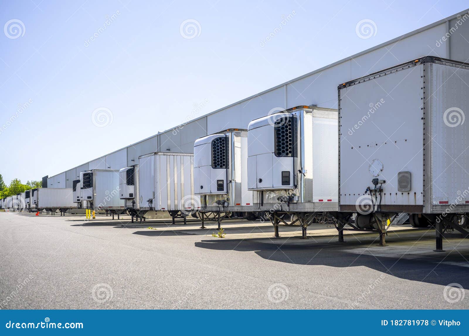 Semi Trailers Waiting Loading And Unloading In The Dock Of Warehouse ...