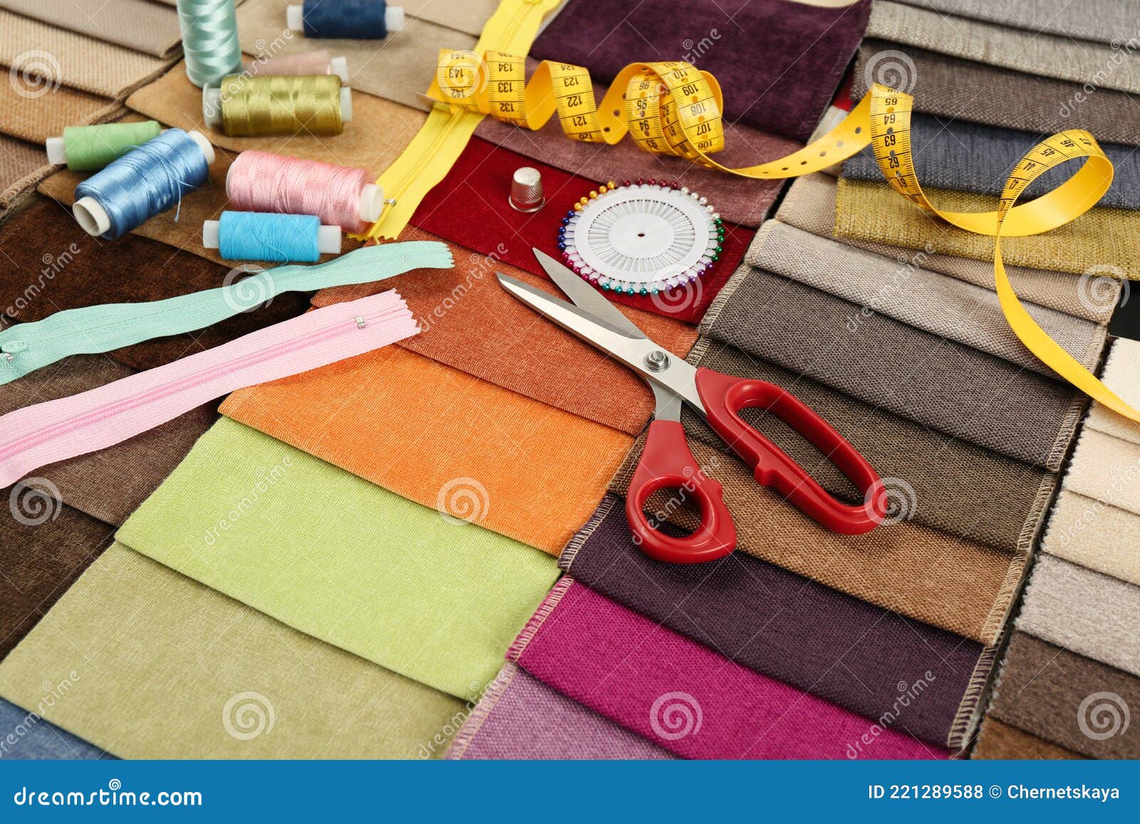 Different Sewing Accessories on Colorful Fabric Samples Stock Photo ...