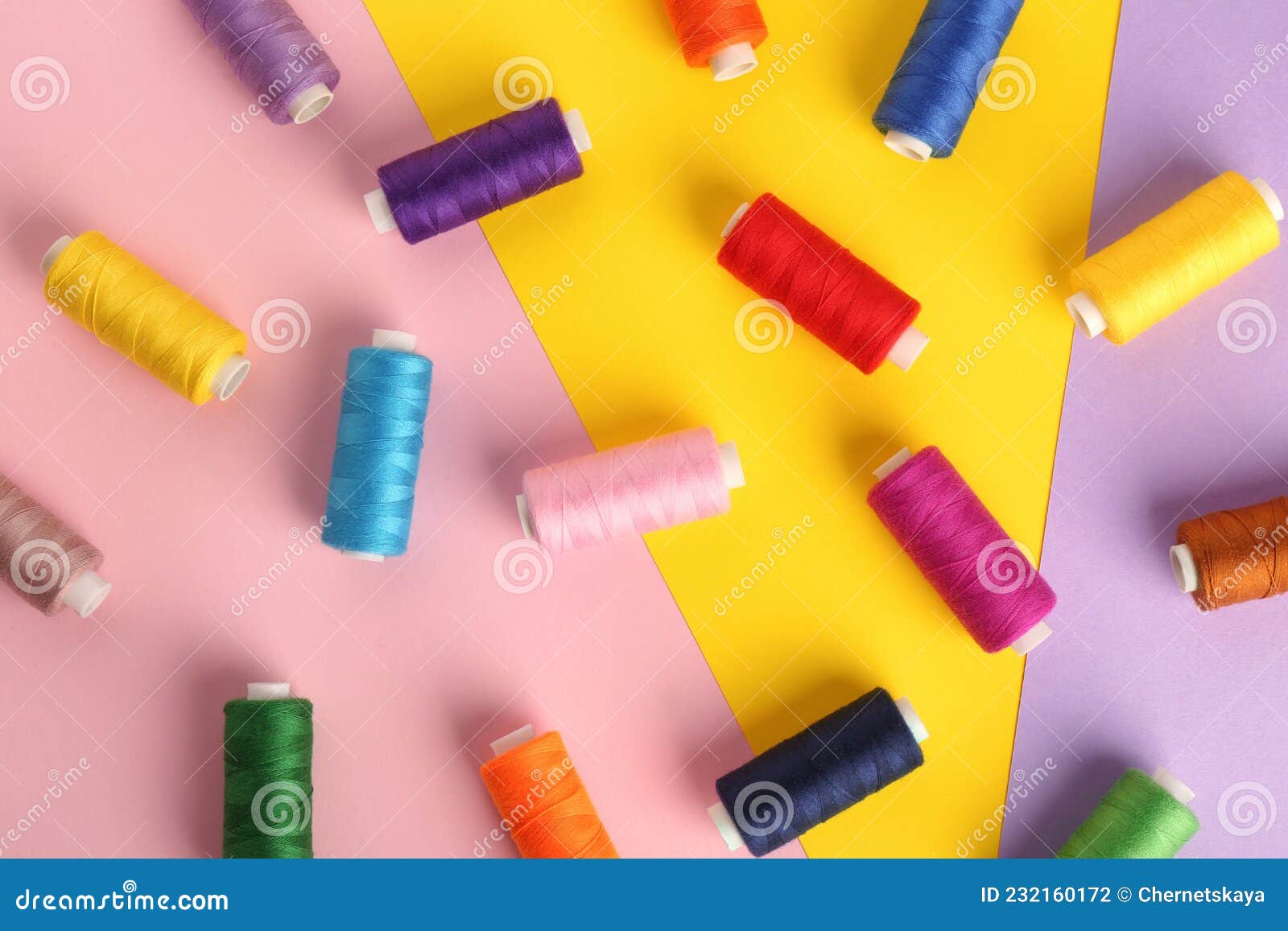 Different Sewing Threads on Color Background, Flat Lay Stock Photo ...