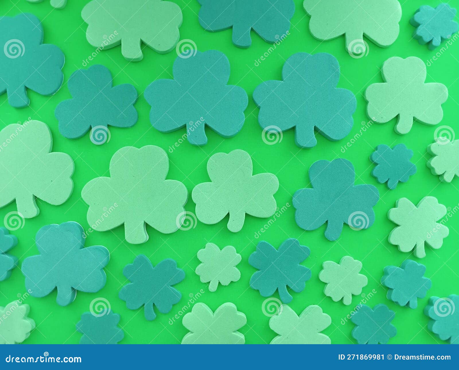 Different Shades and Sizes of Green Shamrocks on a Green Background As ...