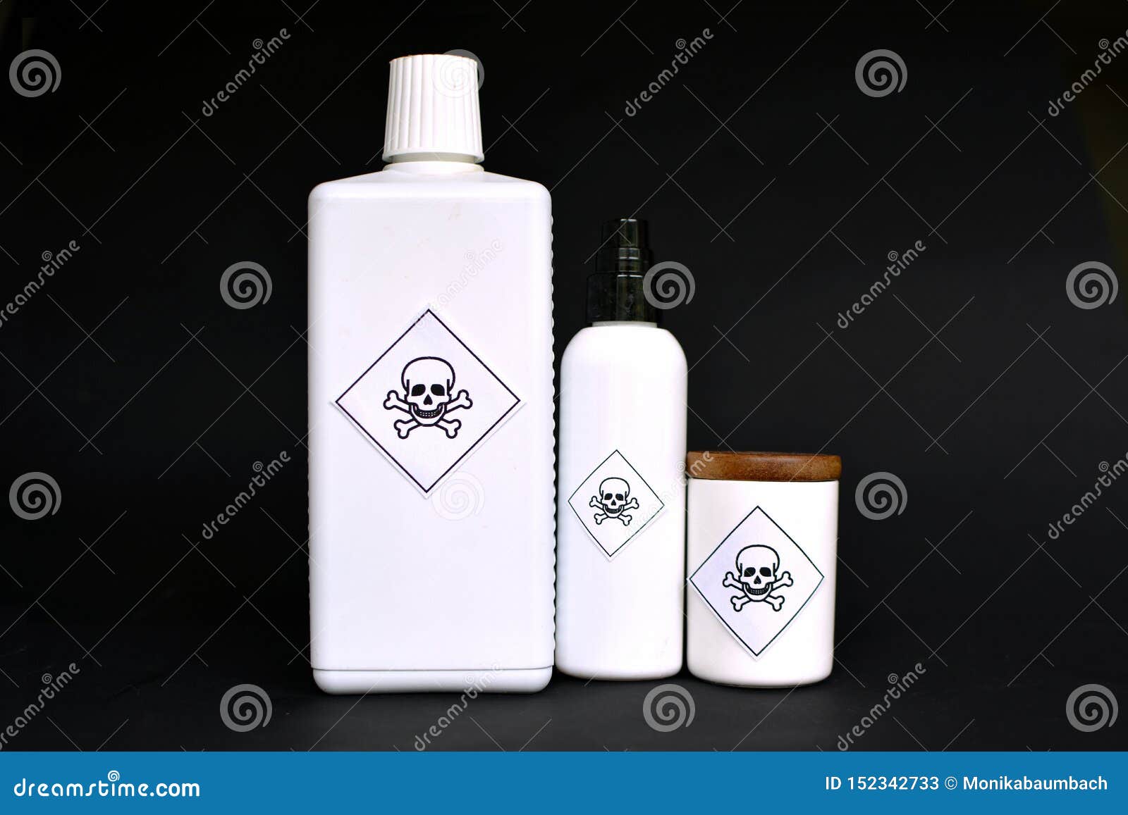 Different Shaped White Containers with Poison Labels on Black ...