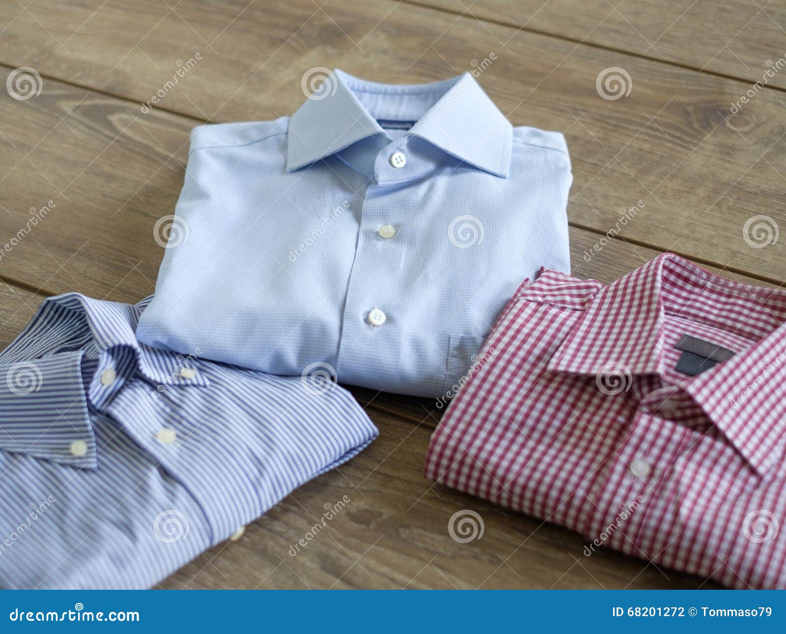 Different Shirts on a Wood Table Stock Photo - Image of stripes, wood ...