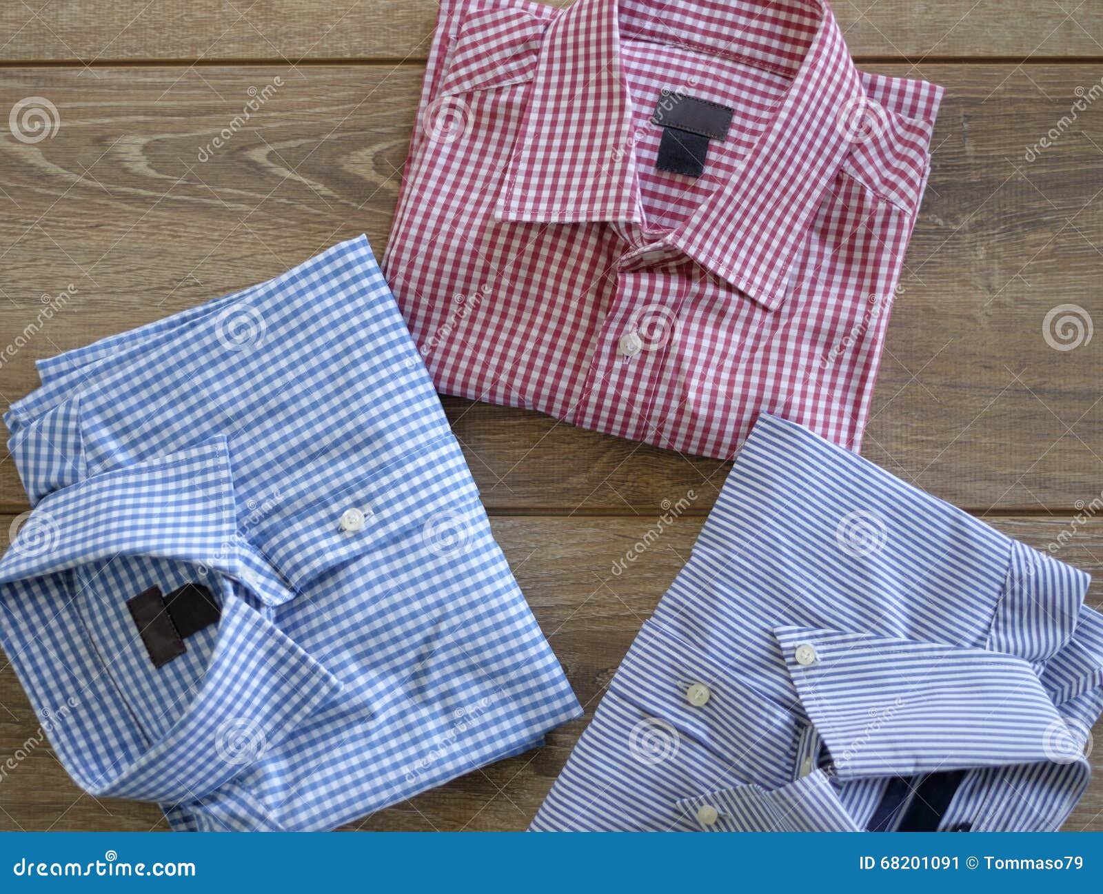 Different Shirts on a Wooden Table Stock Image - Image of shirt, close ...