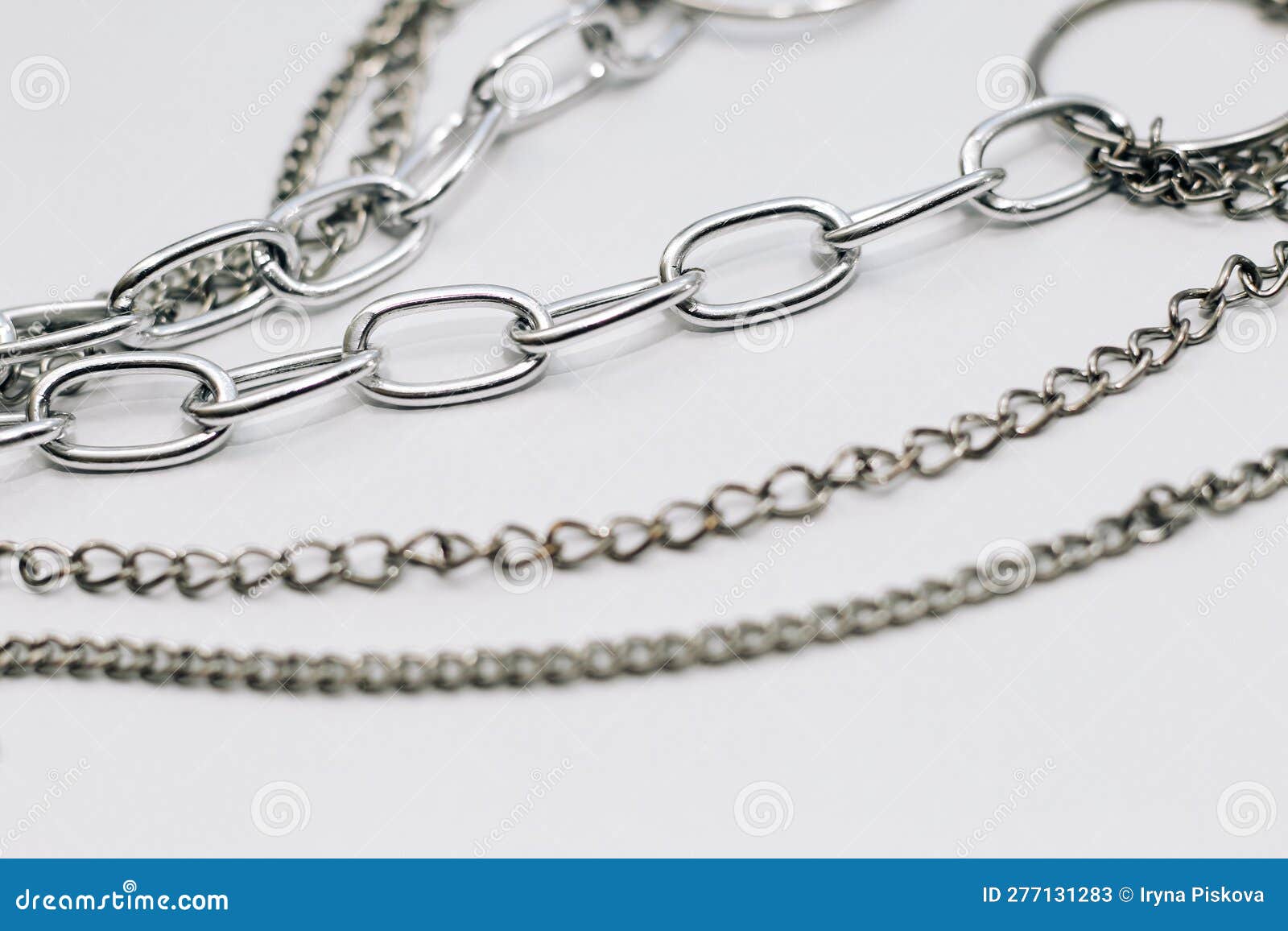 Different Silver Metal Chains on a Light Background. Stock Image ...