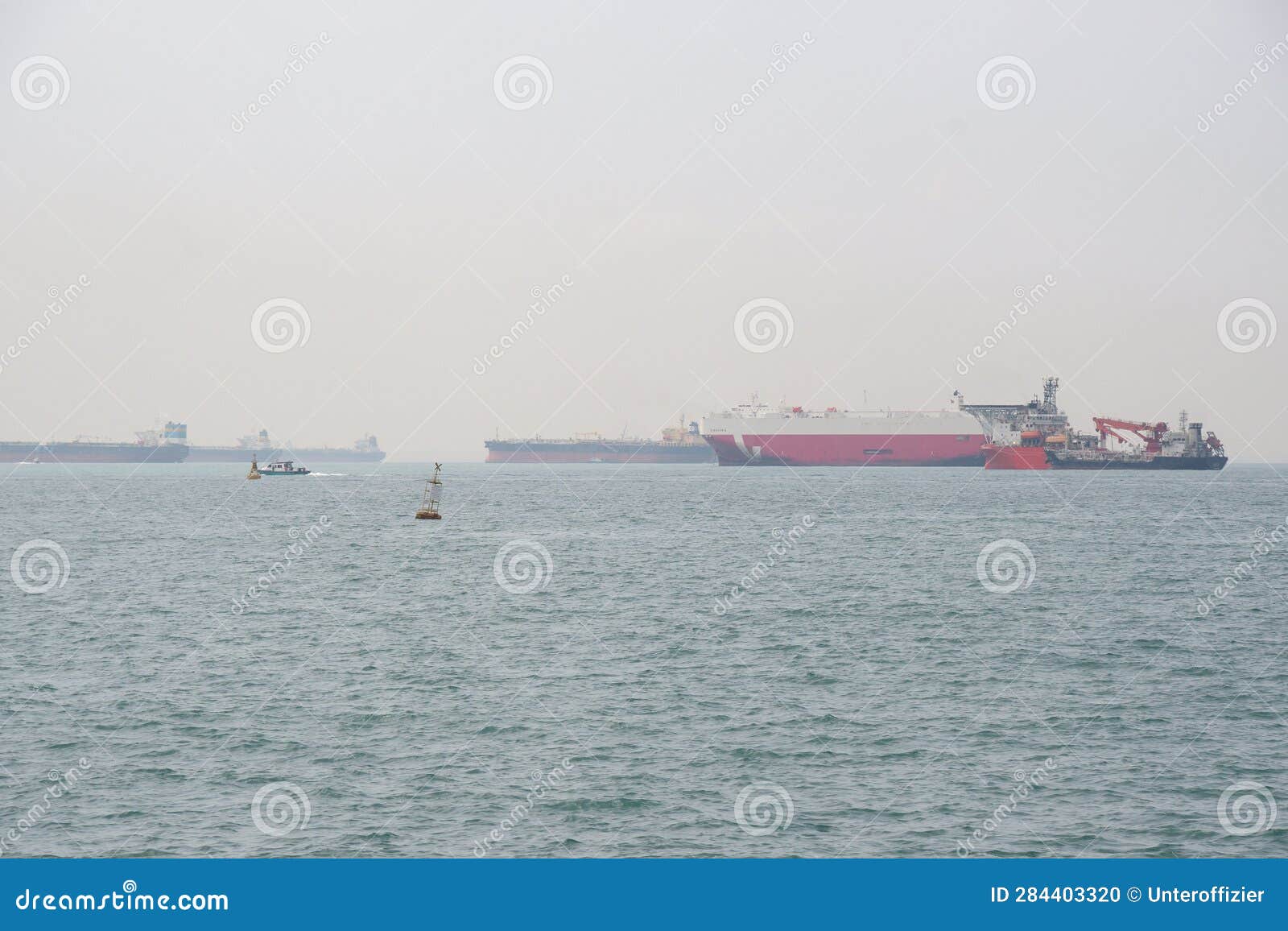 Different Sized Logistical Support Ships Afar from the Shore Stock ...