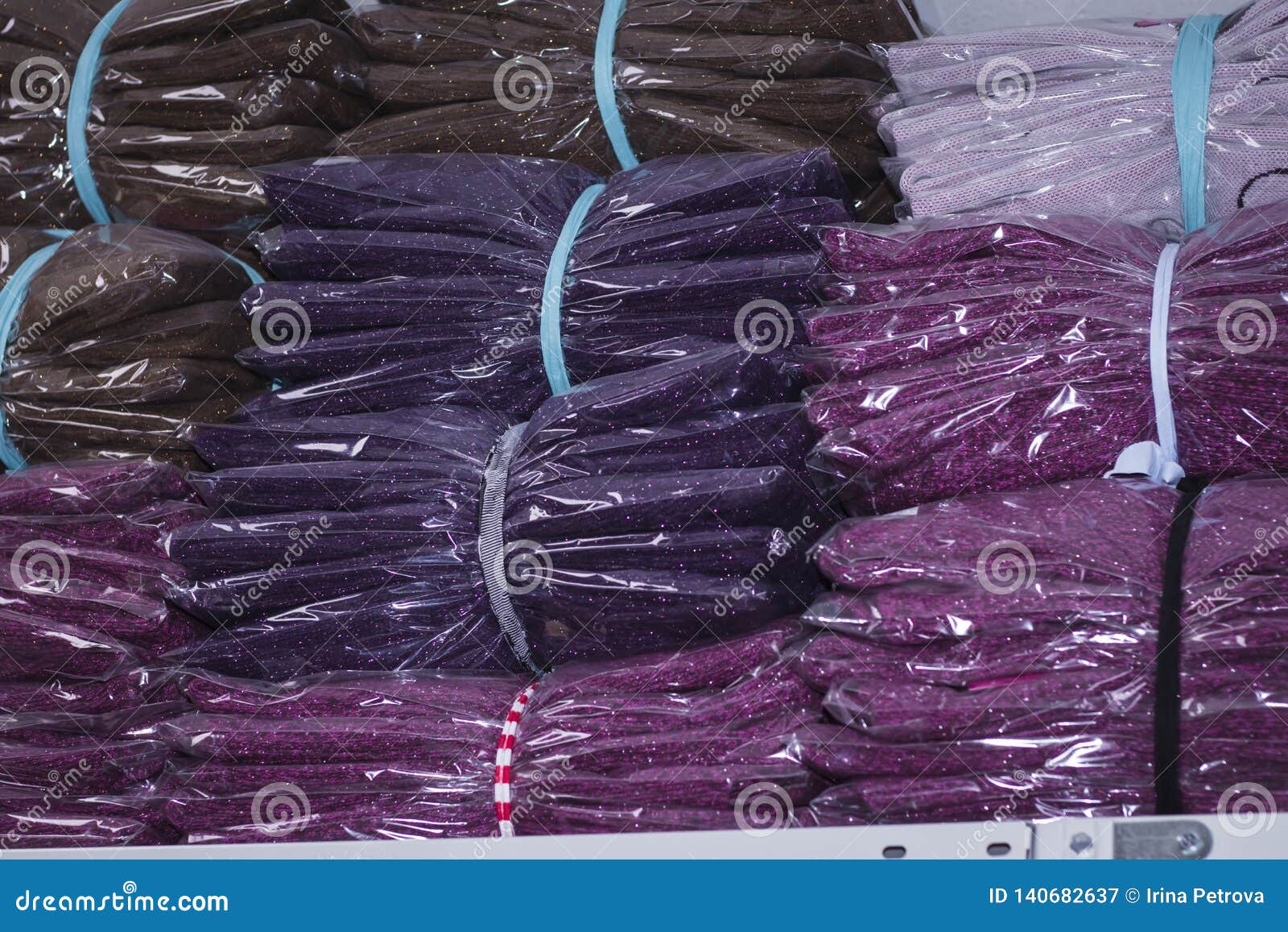 Different Sizes of Clothing in the Store on the Shelves in the Package ...