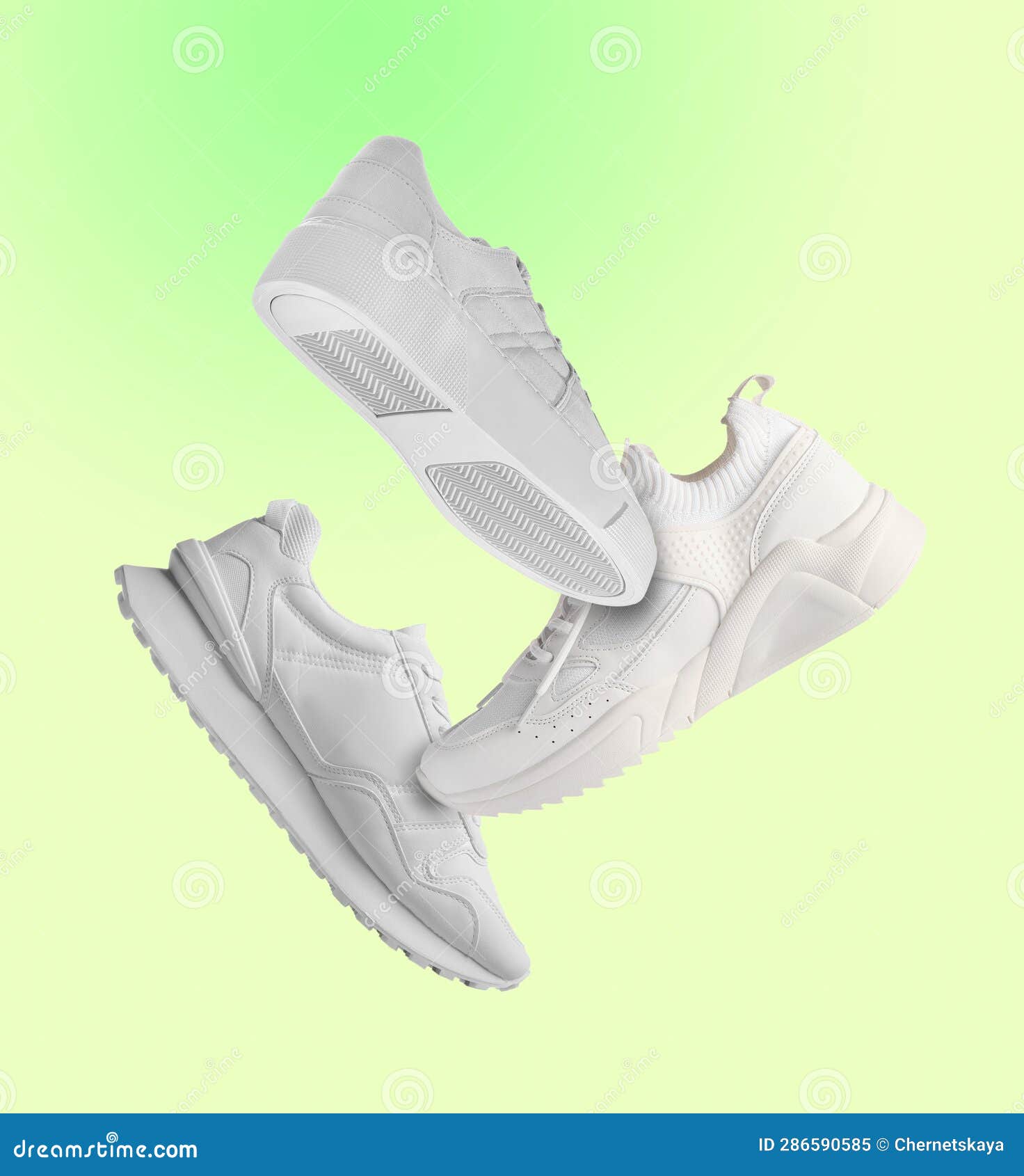 Different Sneakers Falling on Green Gradient Background Stock Image ...