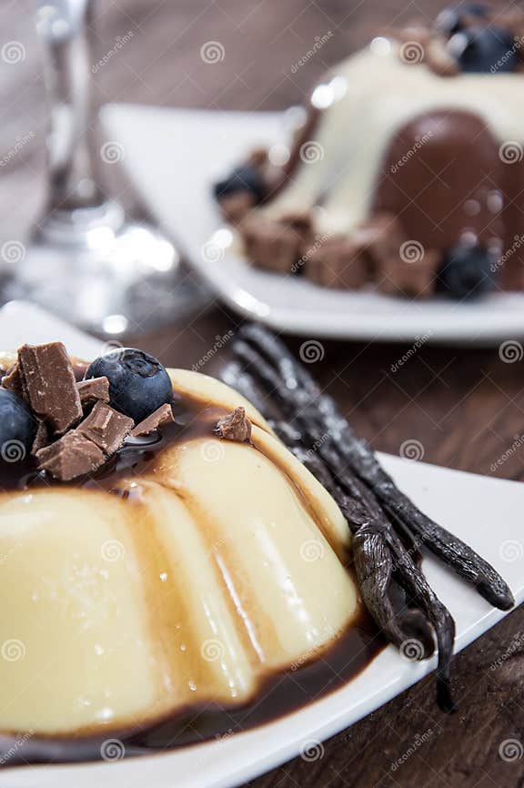 Different Sorts of Pudding on Wooden Background Stock Photo - Image of ...
