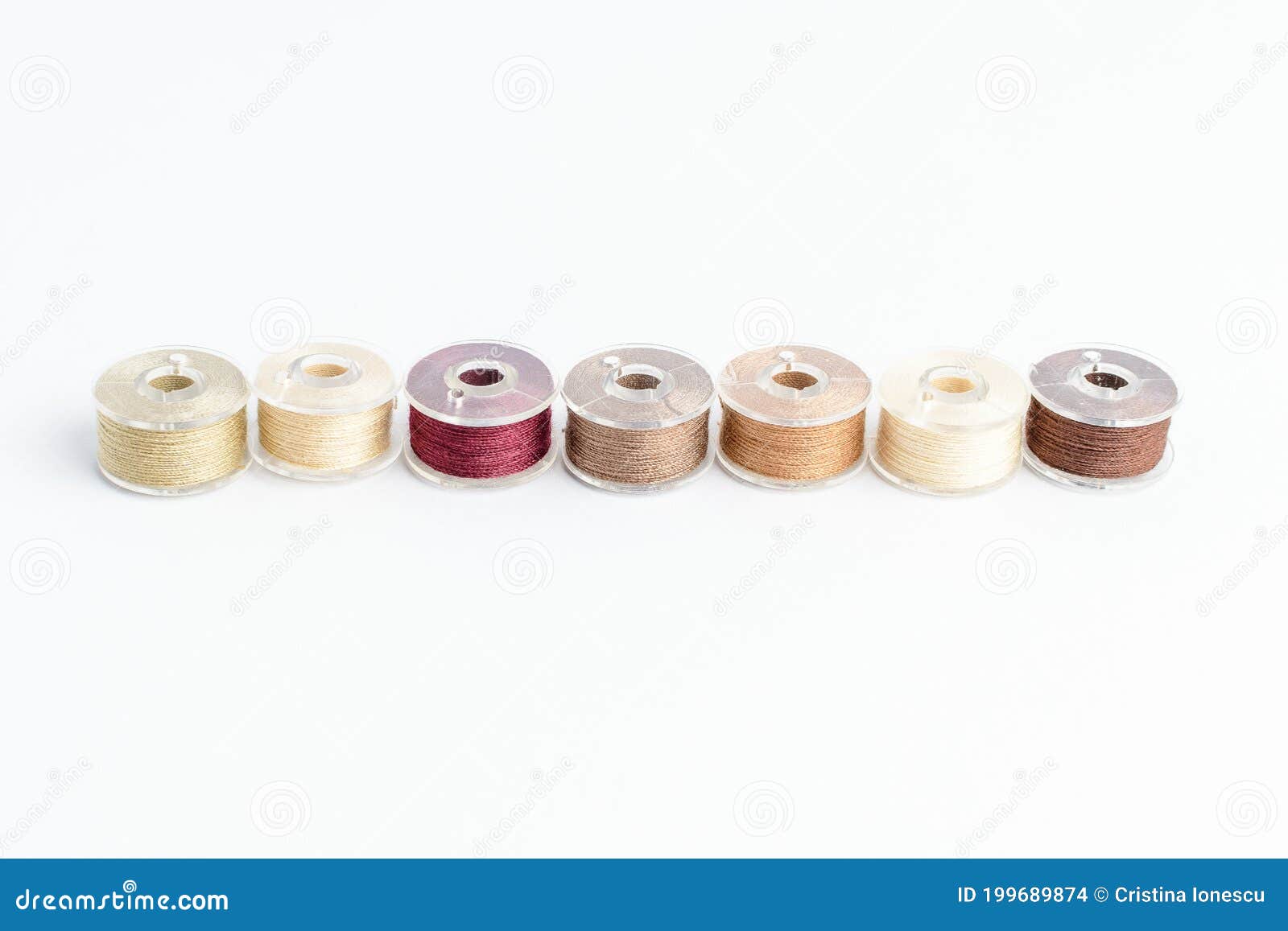 Different Spools of Mixed Beige and Brown Cotton Thread Prepared for ...