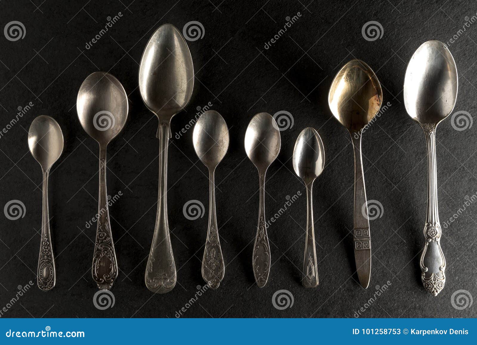 Different Spoons on a Black Stone Top View Stock Image - Image of ...
