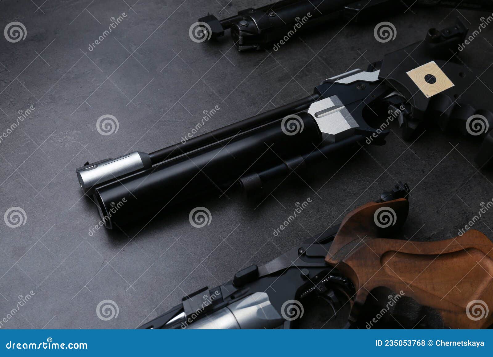 Different Sport Pistols on Black Table. Professional Guns Stock Photo ...