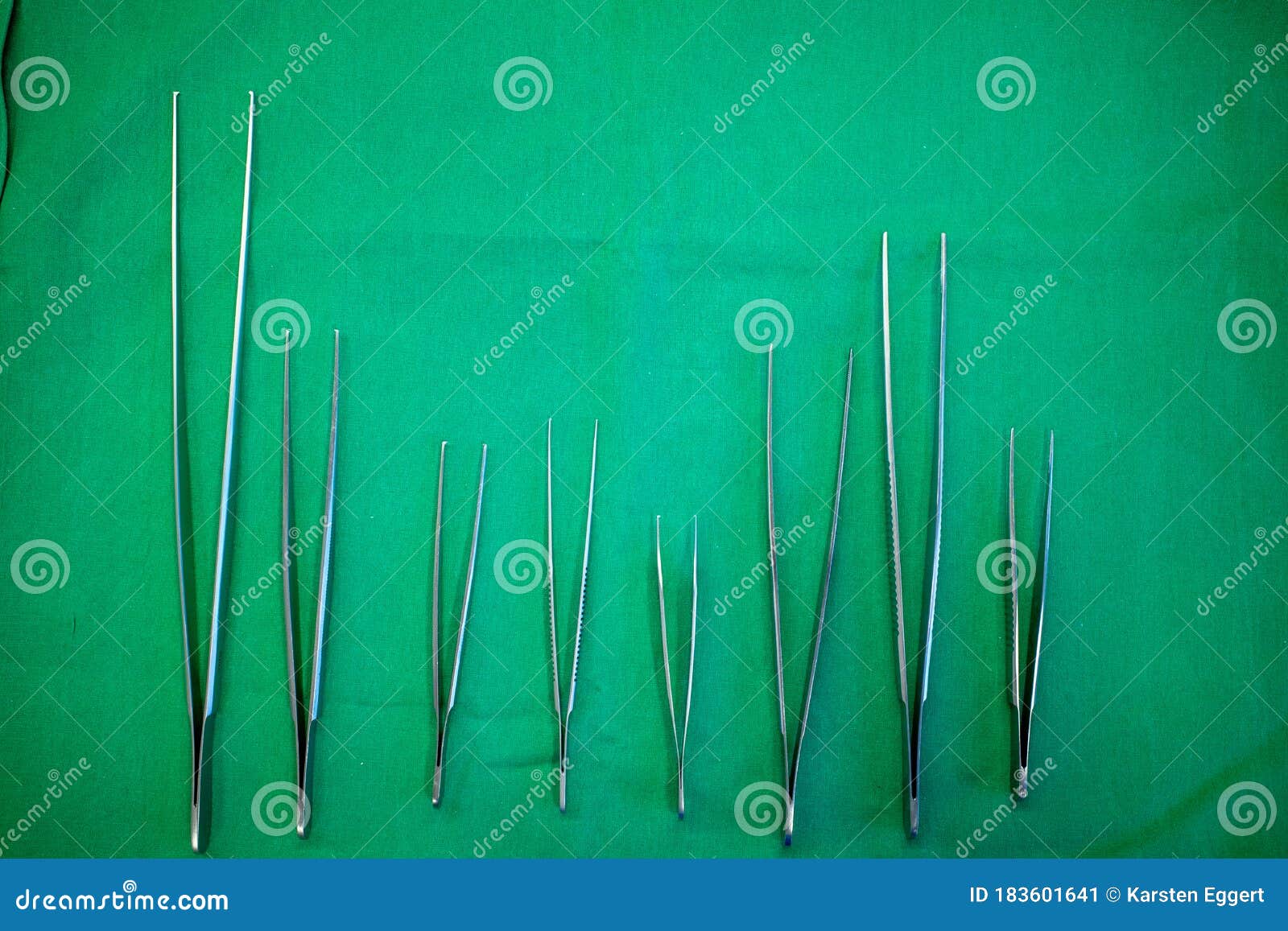 Some Different Surgical Forceps Lie Side by Side on a Surgical Drape ...