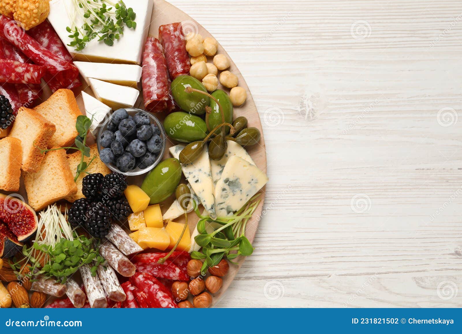 Different Tasty Appetizers on White Wooden Table, Top View. Space for ...