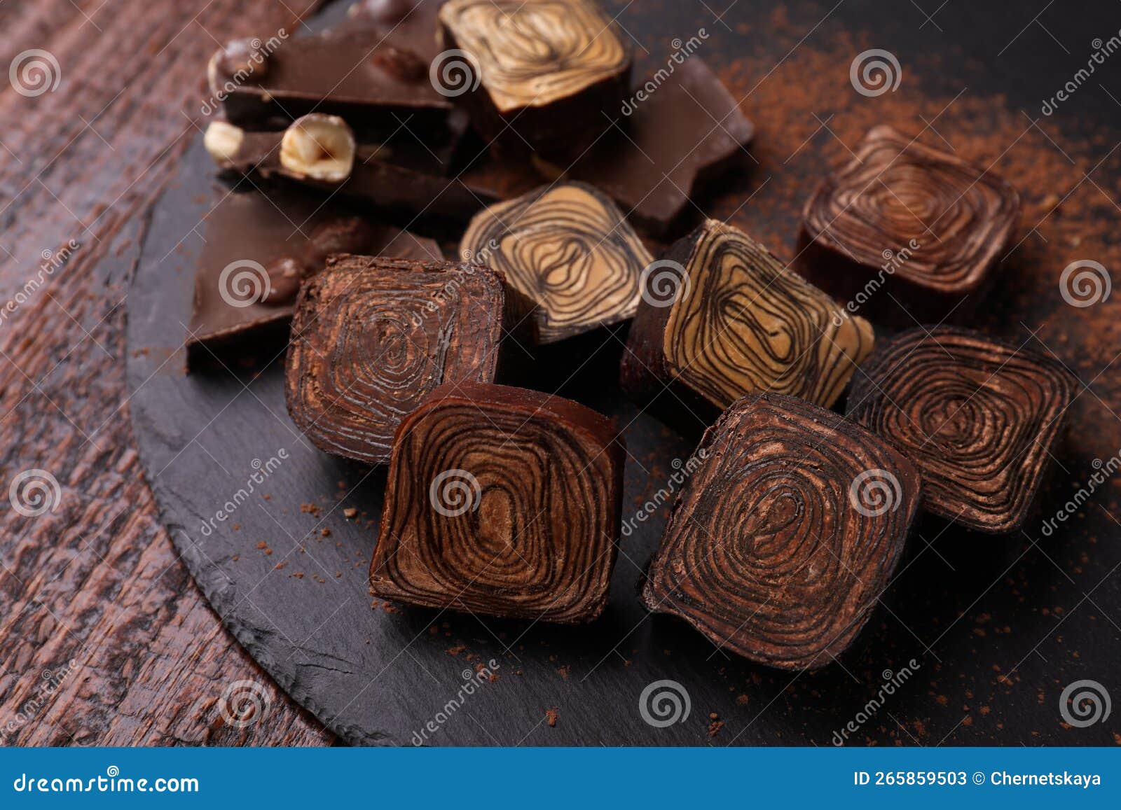 Different Tasty Chocolate Candies on Slate Plate Stock Image - Image of ...