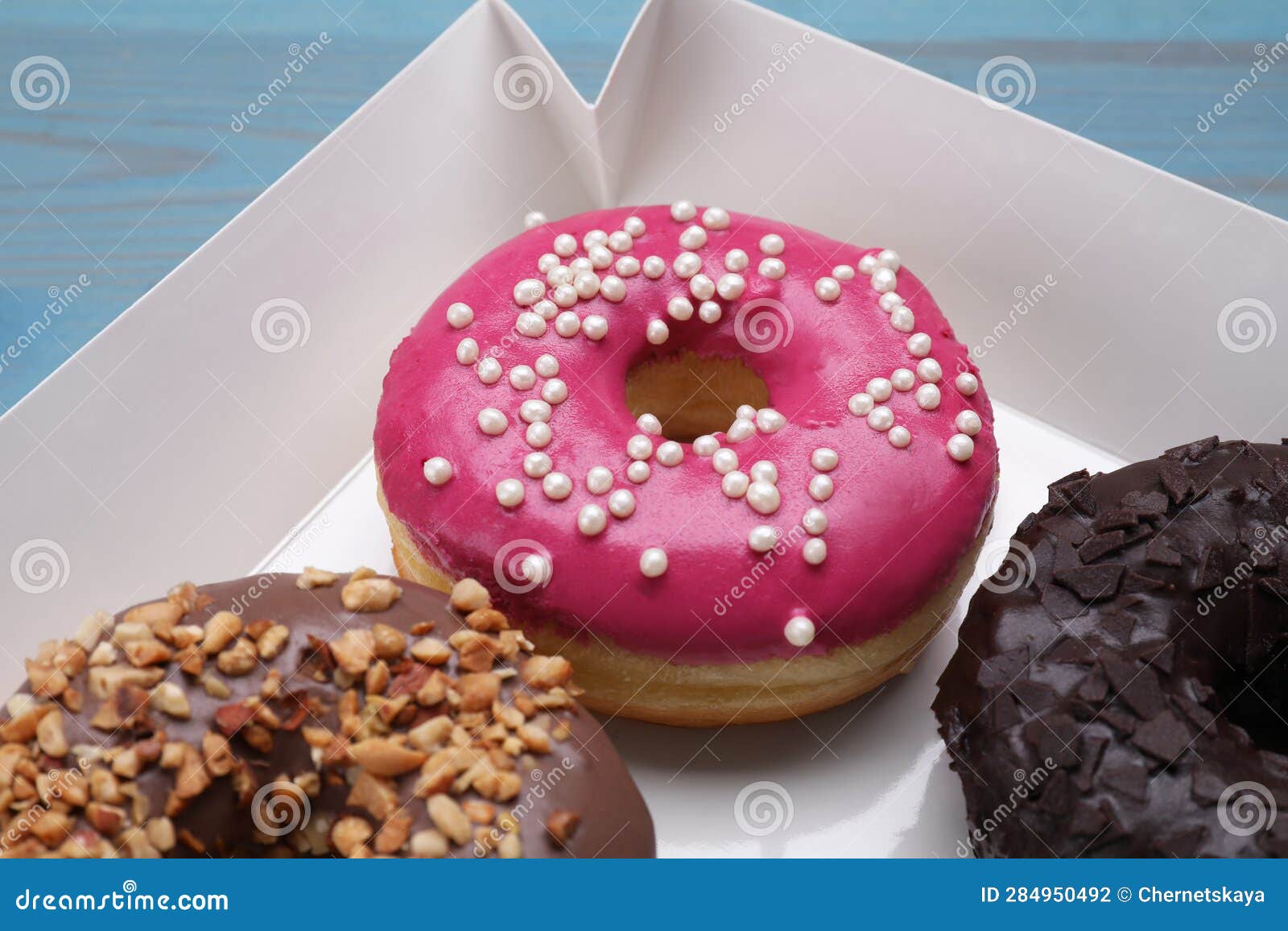 Different Tasty Glazed Donuts in Box, Closeup Stock Photo - Image of ...