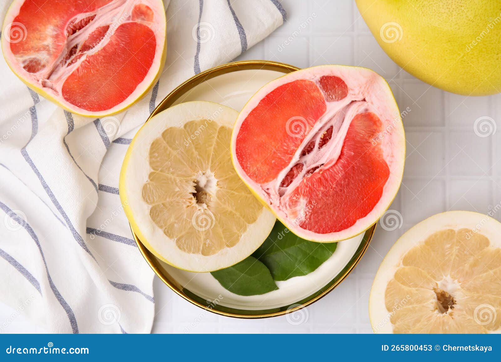Different Tasty Pomelo Fruits on White Tiled Table, Flat Lay Stock ...