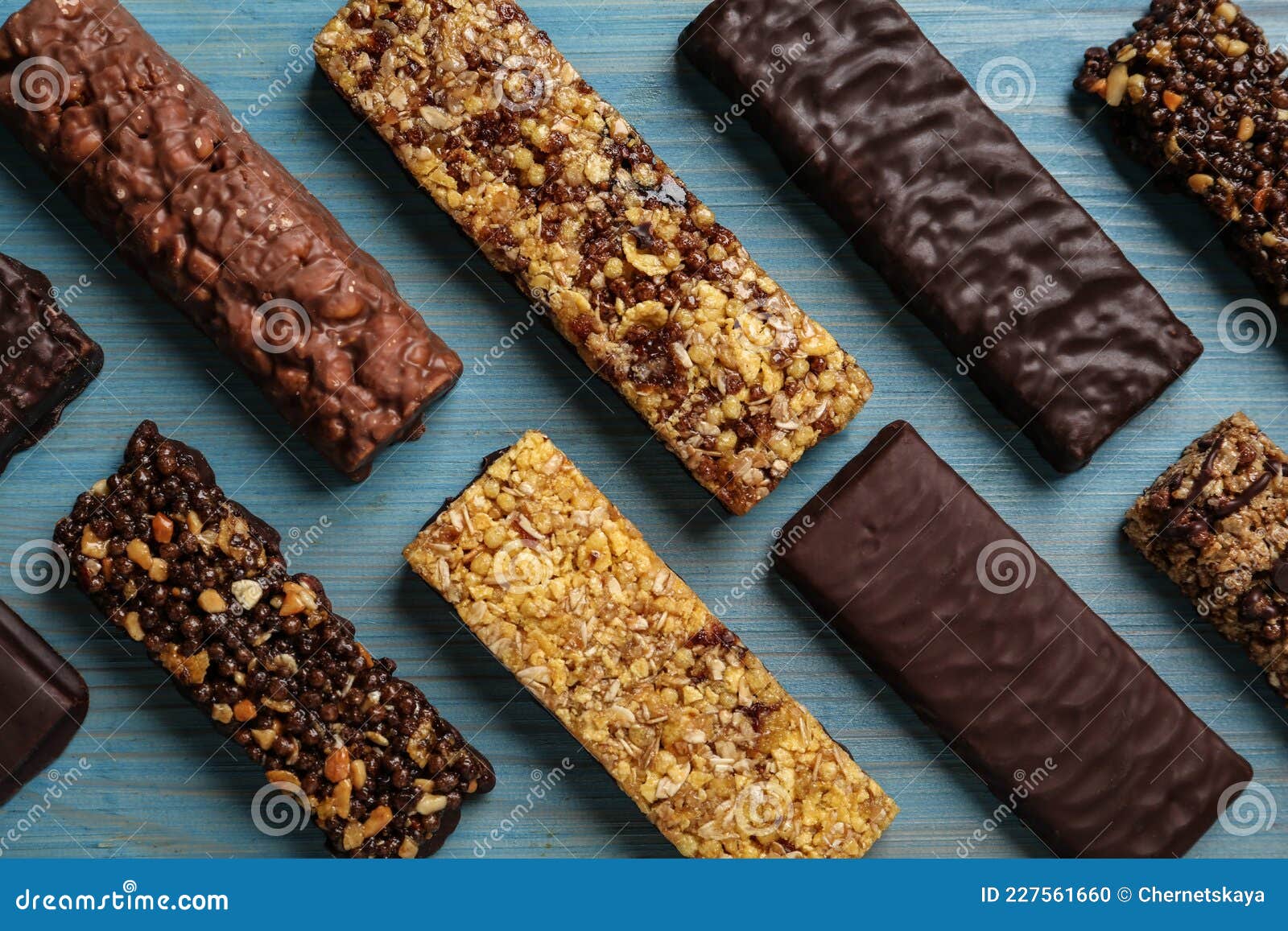 Different Tasty Protein Bars on Light Blue Wooden Table, Flat Lay Stock ...