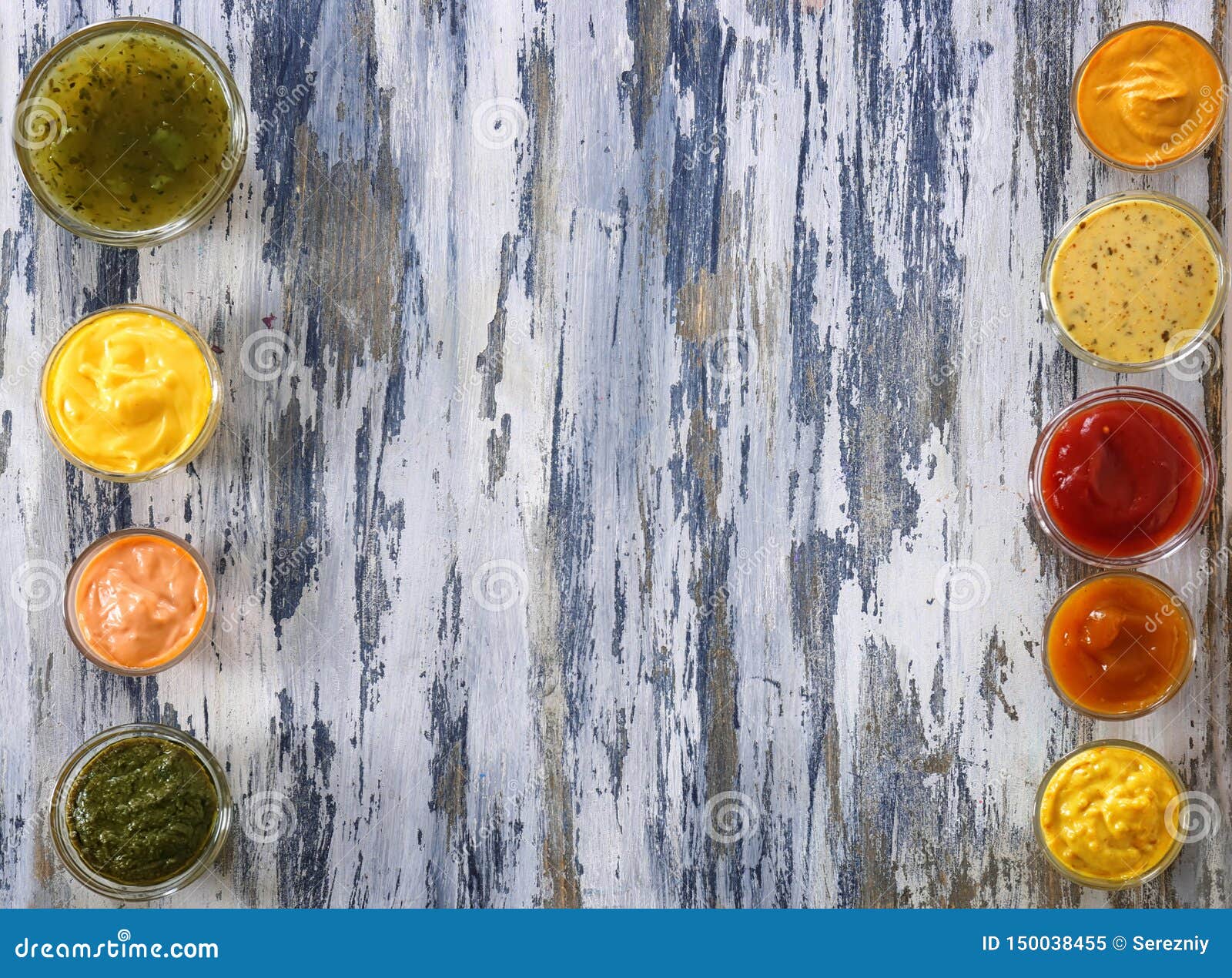 Different Tasty Sauces in Bowls on Wooden Table Stock Image - Image of ...