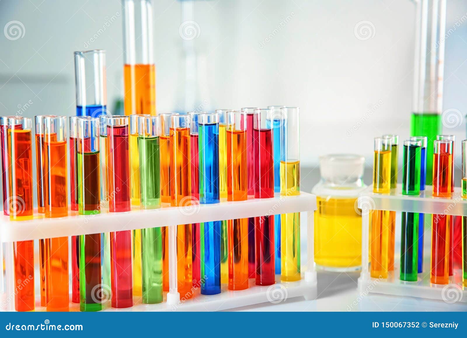Different Test Tubes with Colorful Liquids on Table Stock Photo - Image ...