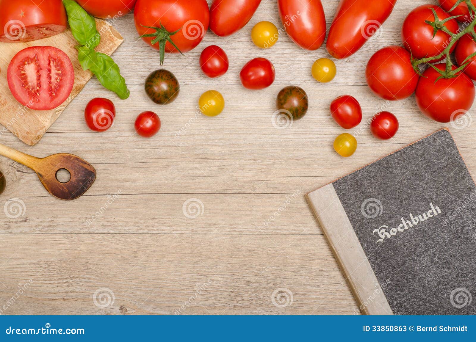 Different Tomatoes with Wooden Spoon and Recipe Book Stock Image ...