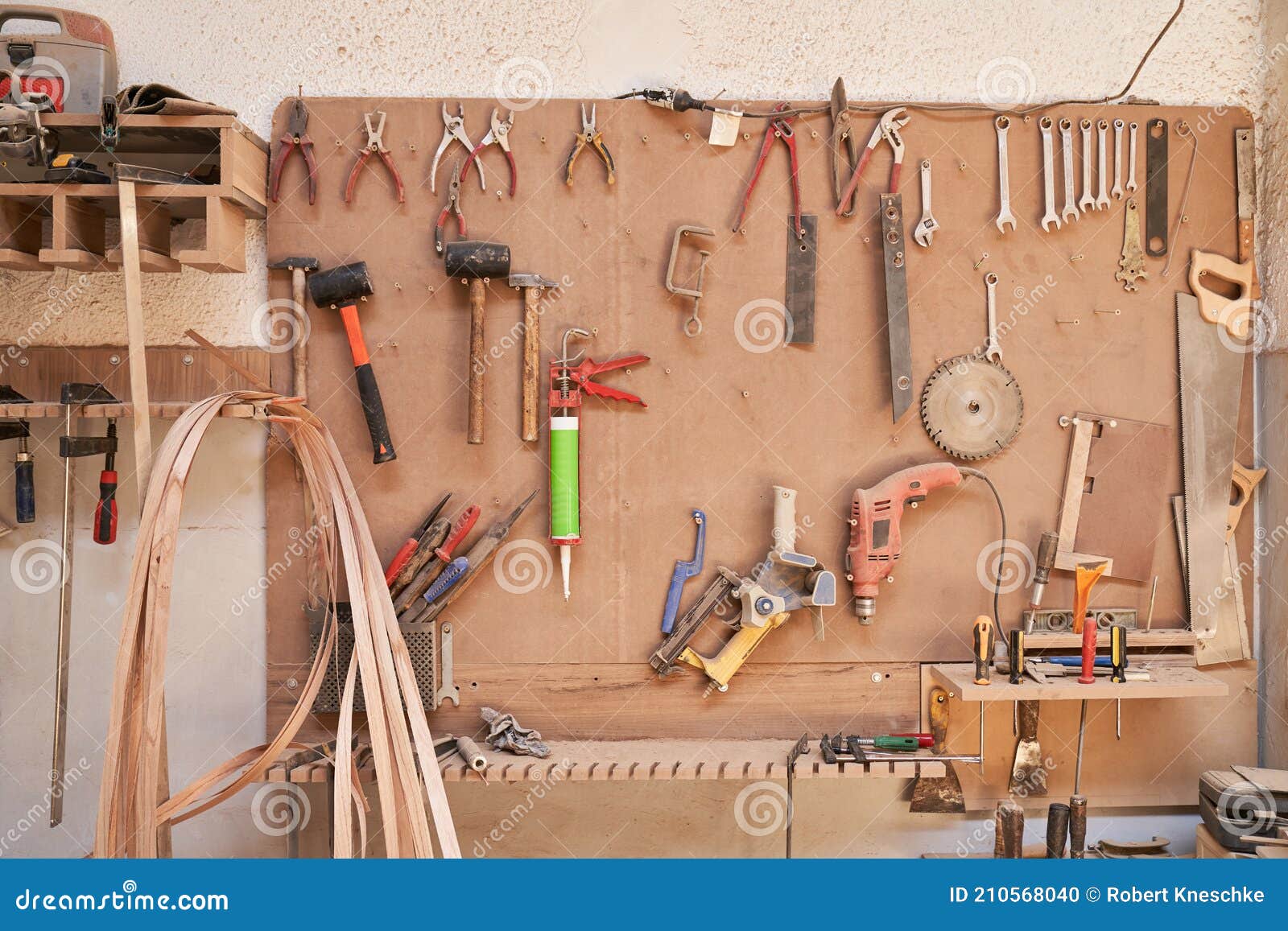 Different Tools Hang on a Wall Stock Photo - Image of middle, workbench ...