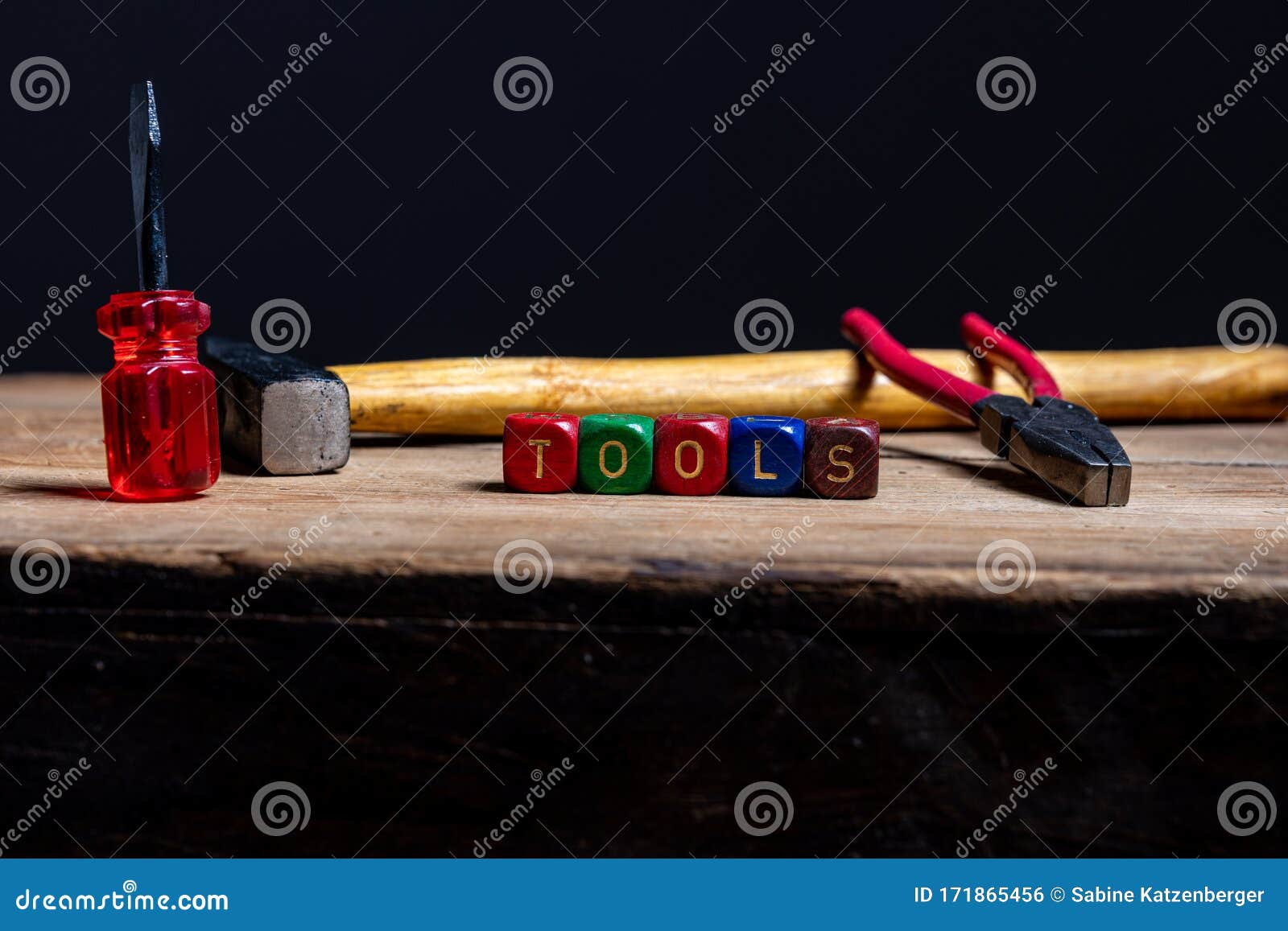 Different Tools and the Letters Tools on a Wooden Surface Stock Photo ...