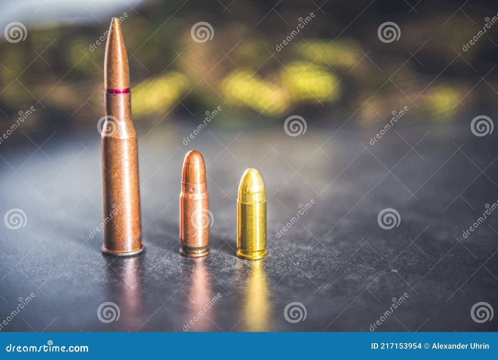 Different Types of Ammunition on Dark Stone. Blur Bullets Backround ...
