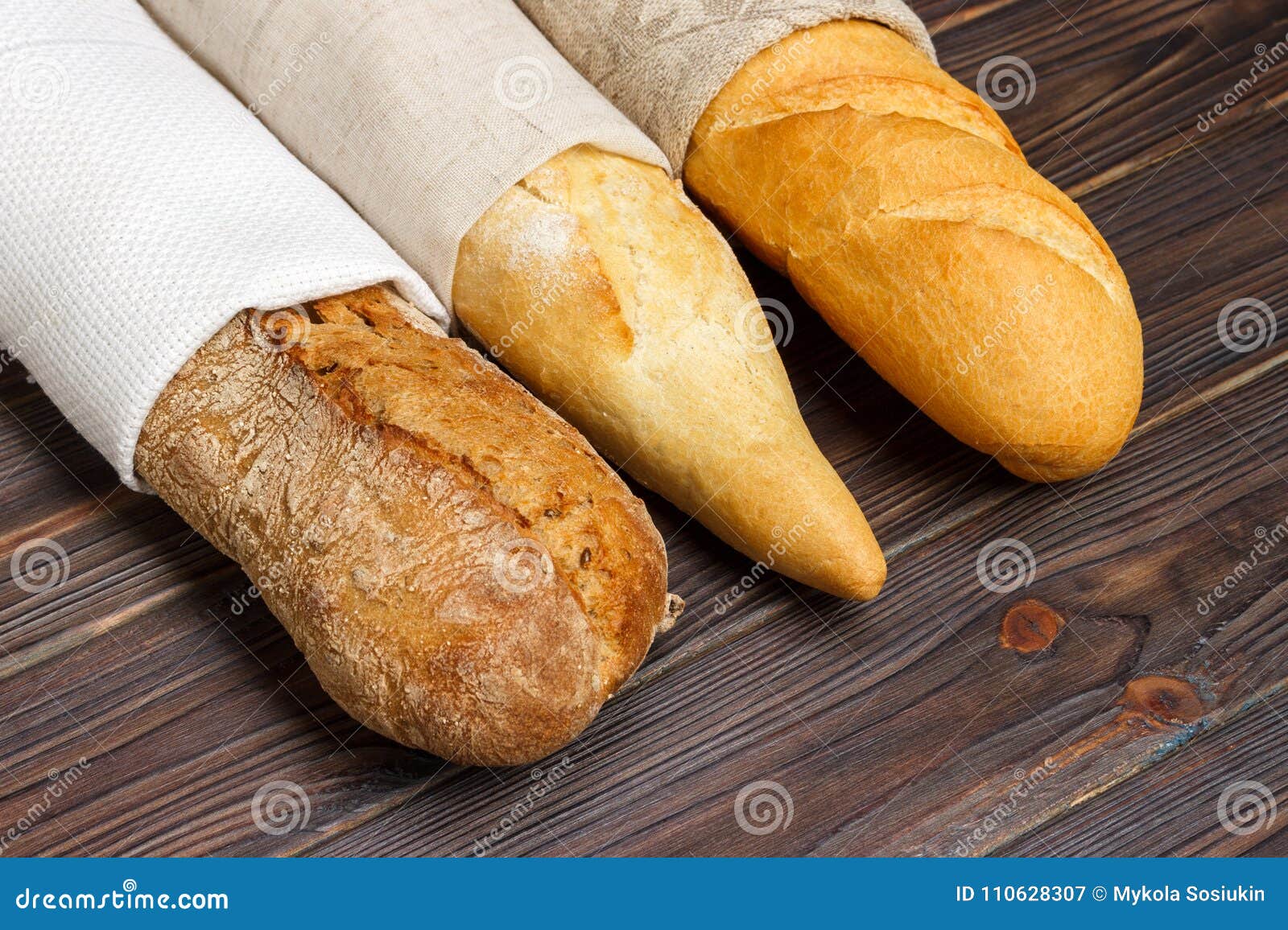 Different Types of Baguette on a Wooden Background Stock Image - Image ...