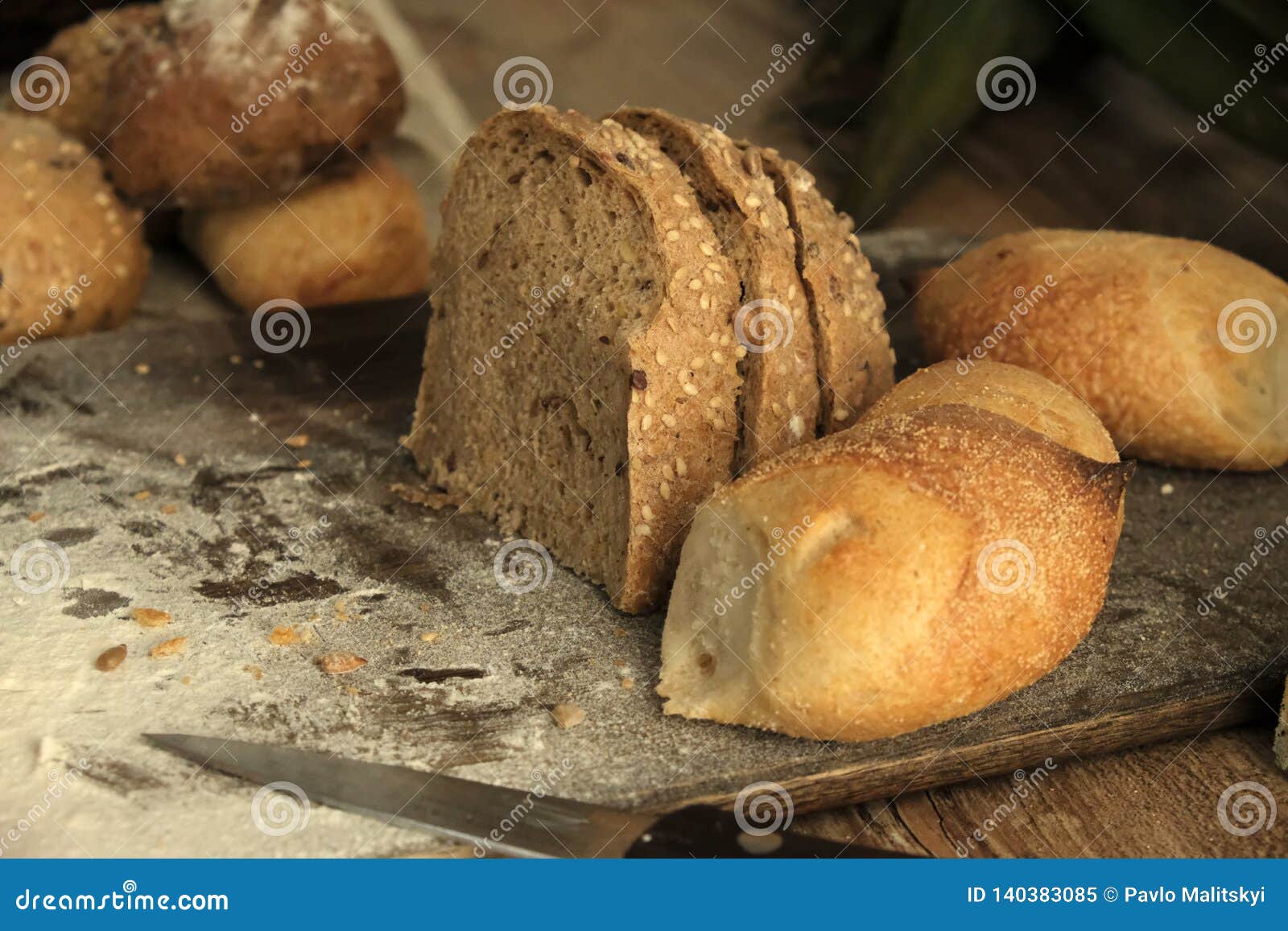 Different Types of Baked Bread on a Dark Brow Table. Bread on a Brown ...