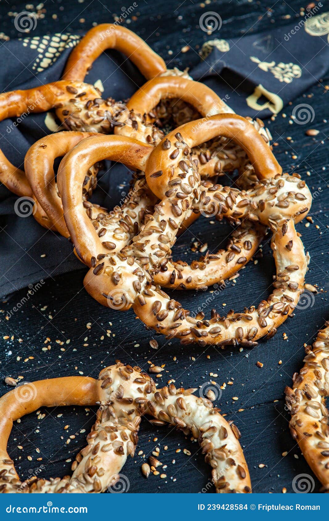Different Types of Baked Pretzels with Seeds on a Black Background ...