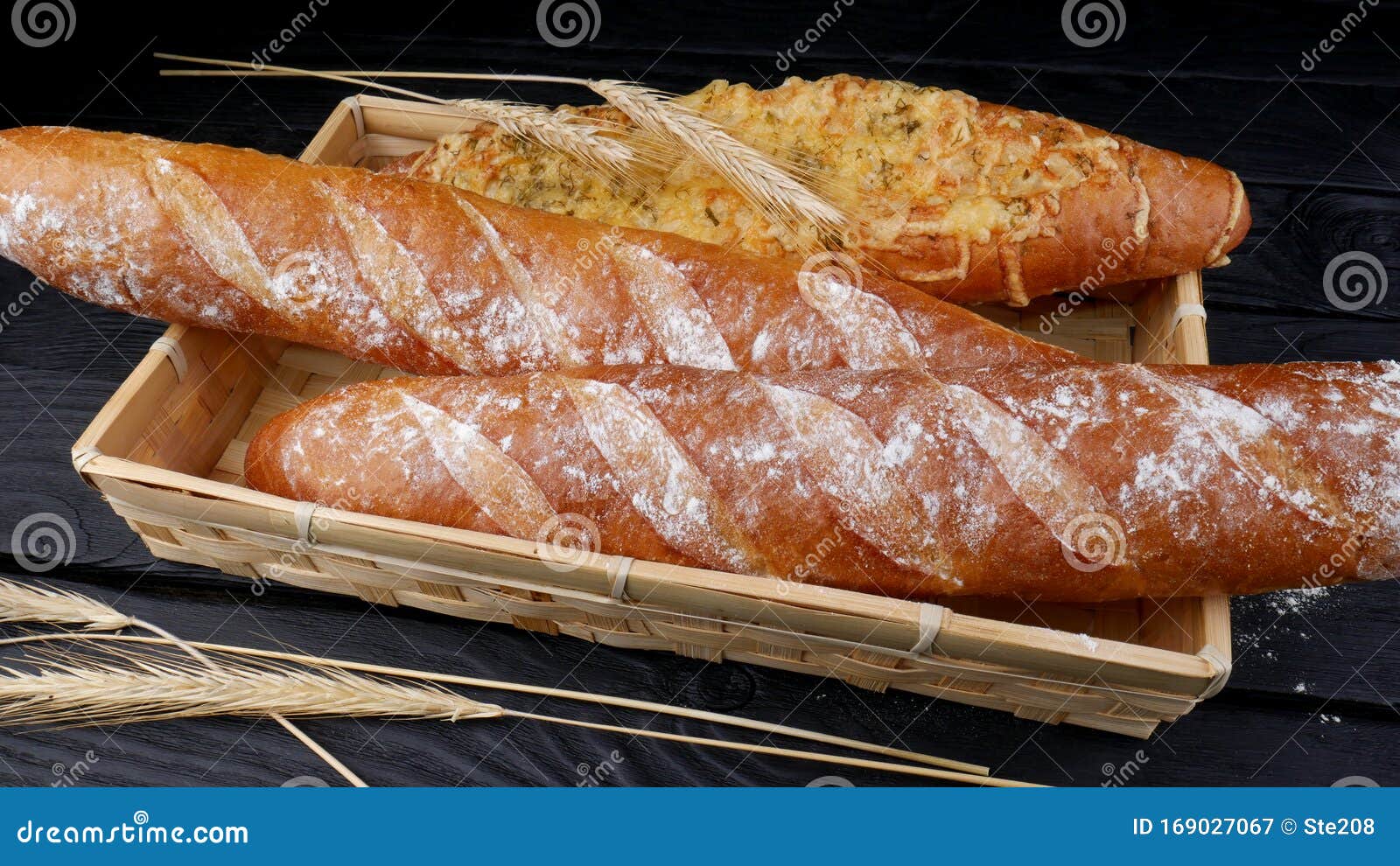 Different Types of Bread Baguettes with Spikelets of Wheat in a Wicker ...