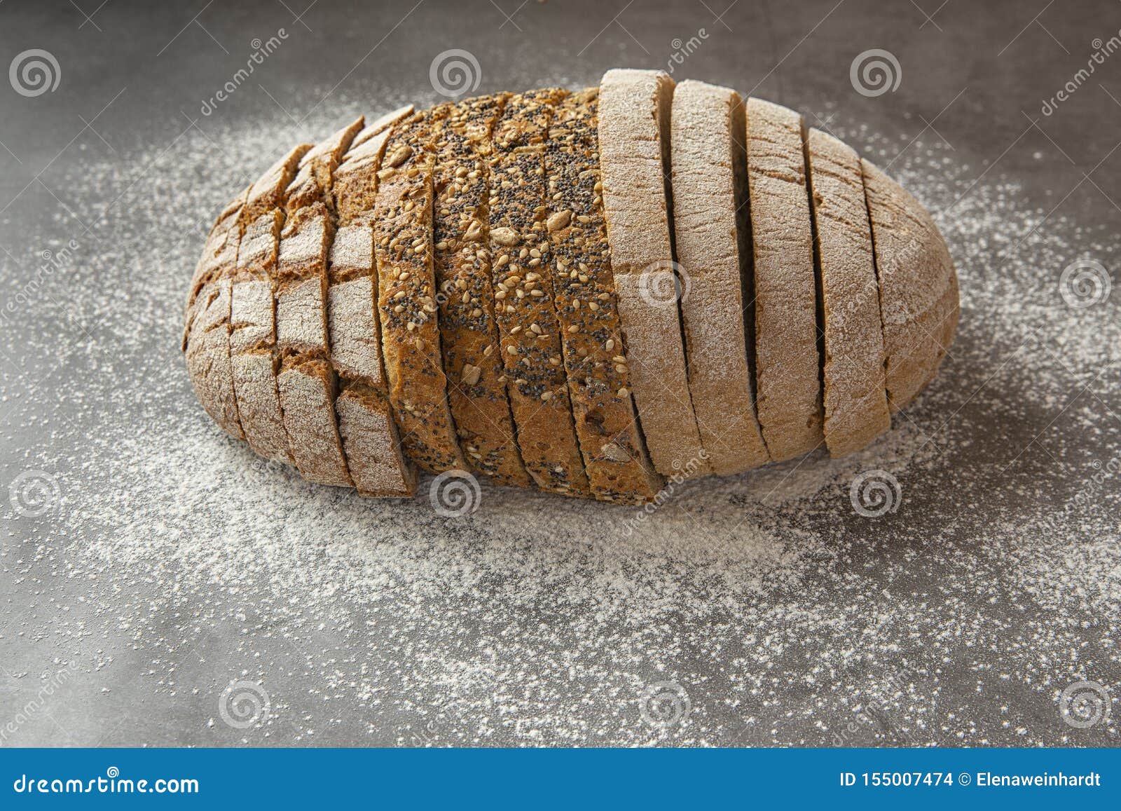 Different Types of Bread Sliced on a Dark Background Sprinkled with ...