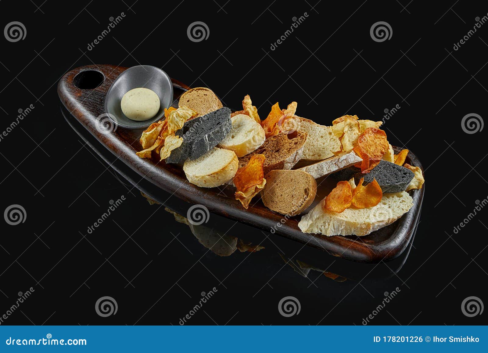 Different Types of Bread - White, Rye and Ink Cuttlefish on a Wooden ...
