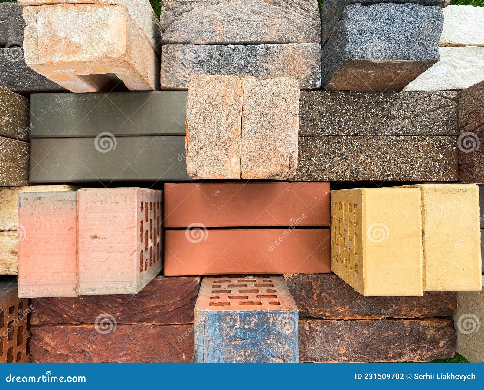 Different Types of Bricks Stacked Beautifully on Green Grass. Top View ...