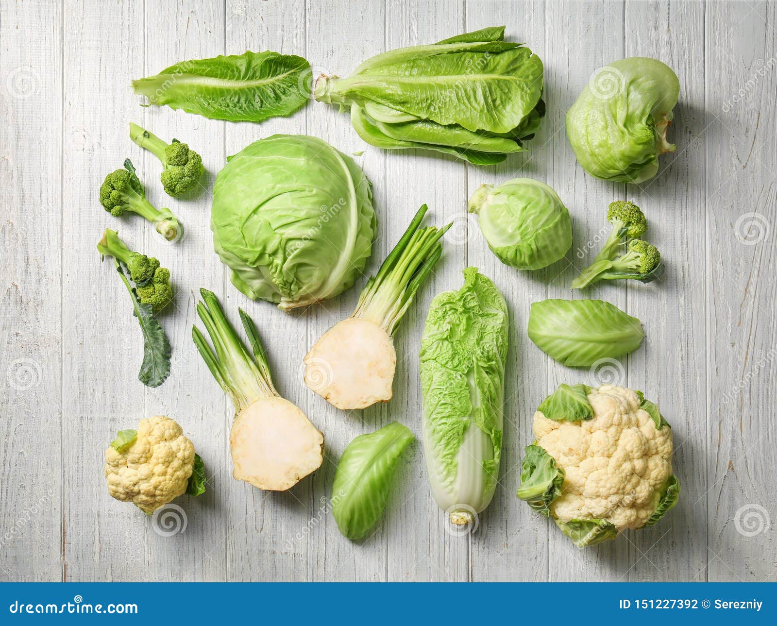 Different Types of Cabbage on Light Wooden Background Stock Photo ...