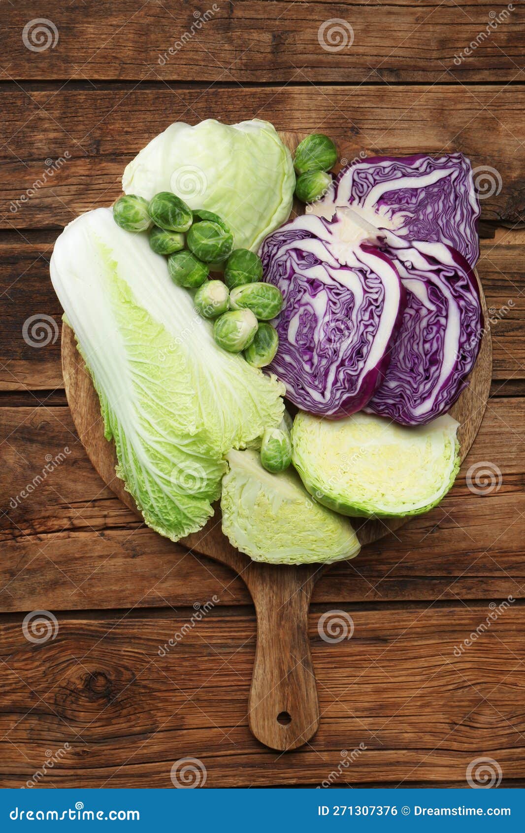 Different Types of Cabbage on Wooden Table, Top View Stock Photo ...
