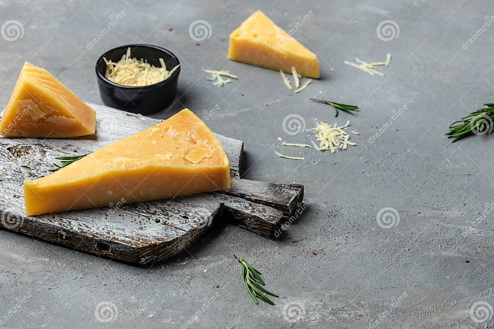Different Types of Cheese. Parmesan Cheese with Rosemary on a Gray ...