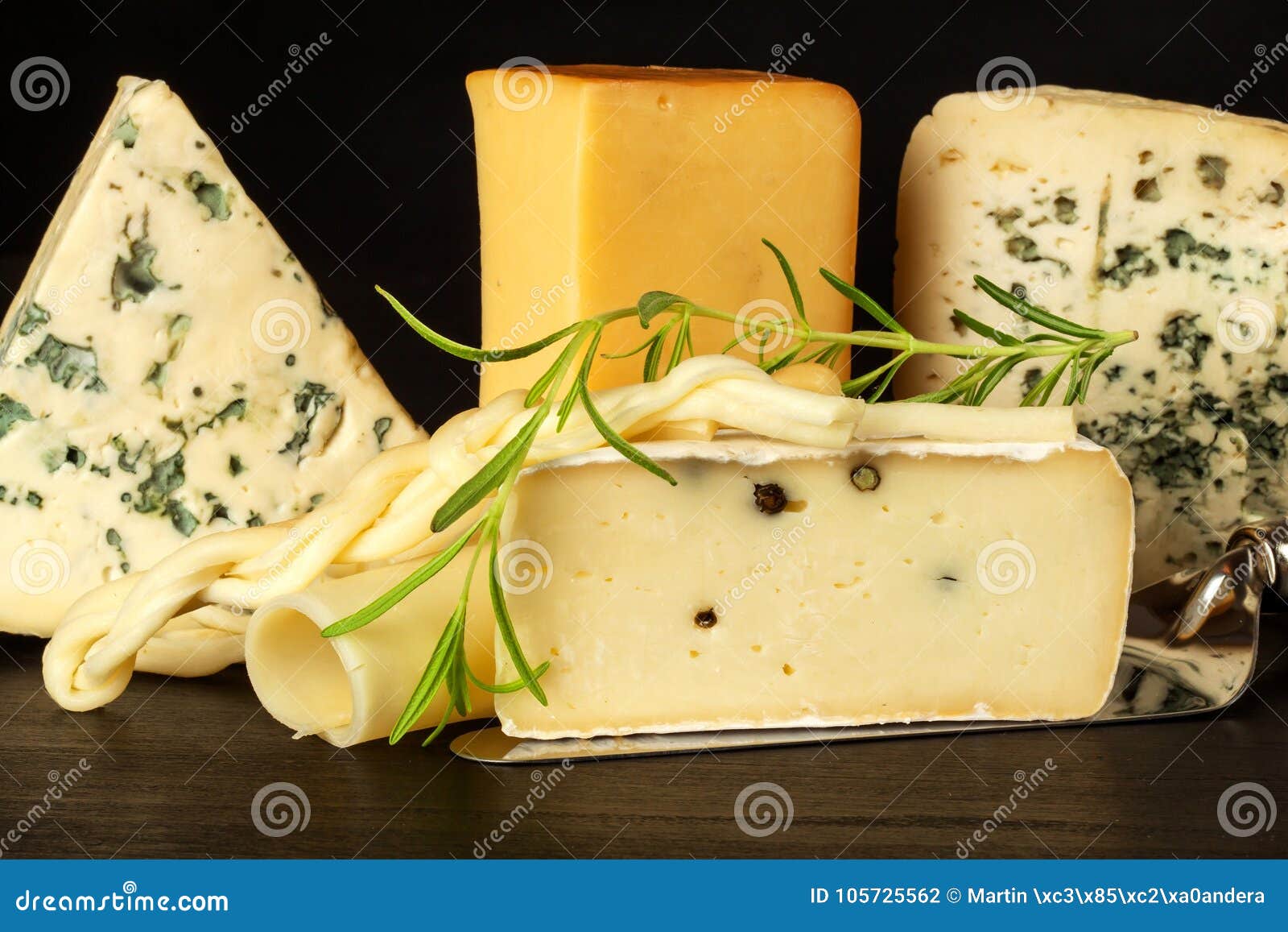Different Types of Cheeses on the Kitchen Table. Preparation of Snacks ...